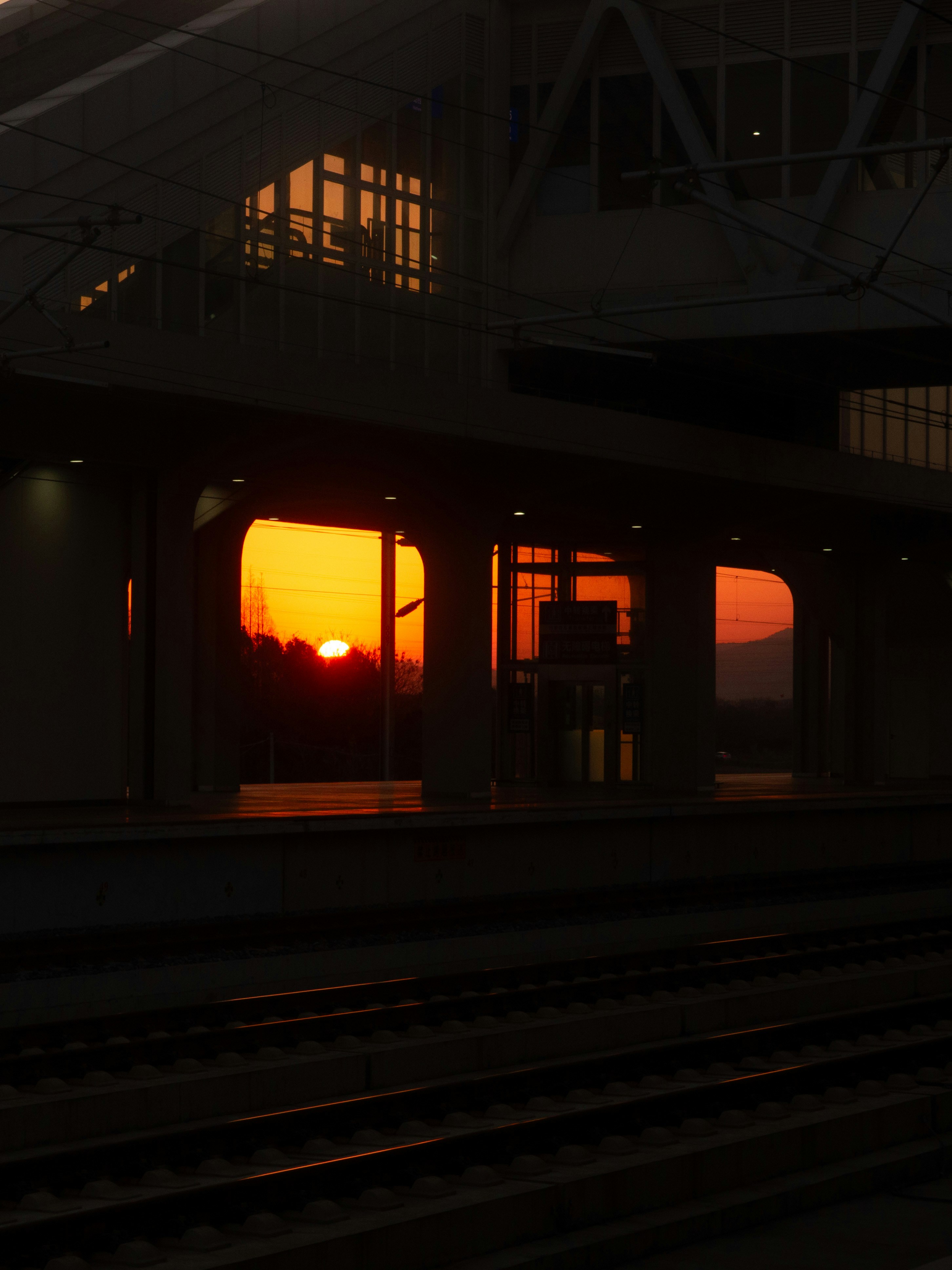 Sunset viewed through a train station window