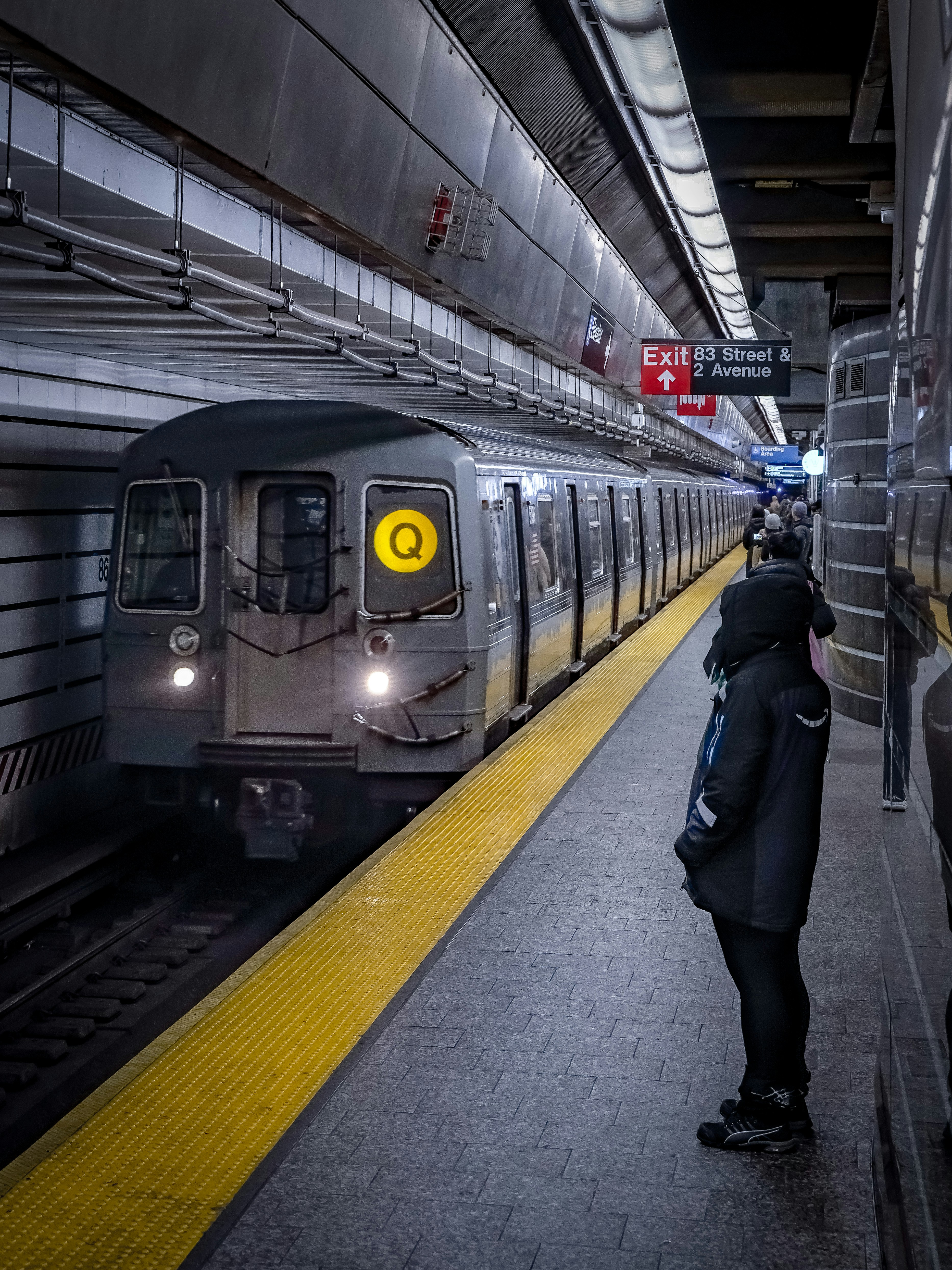 Mid-Platform Convergence: The Q Train at Dusk