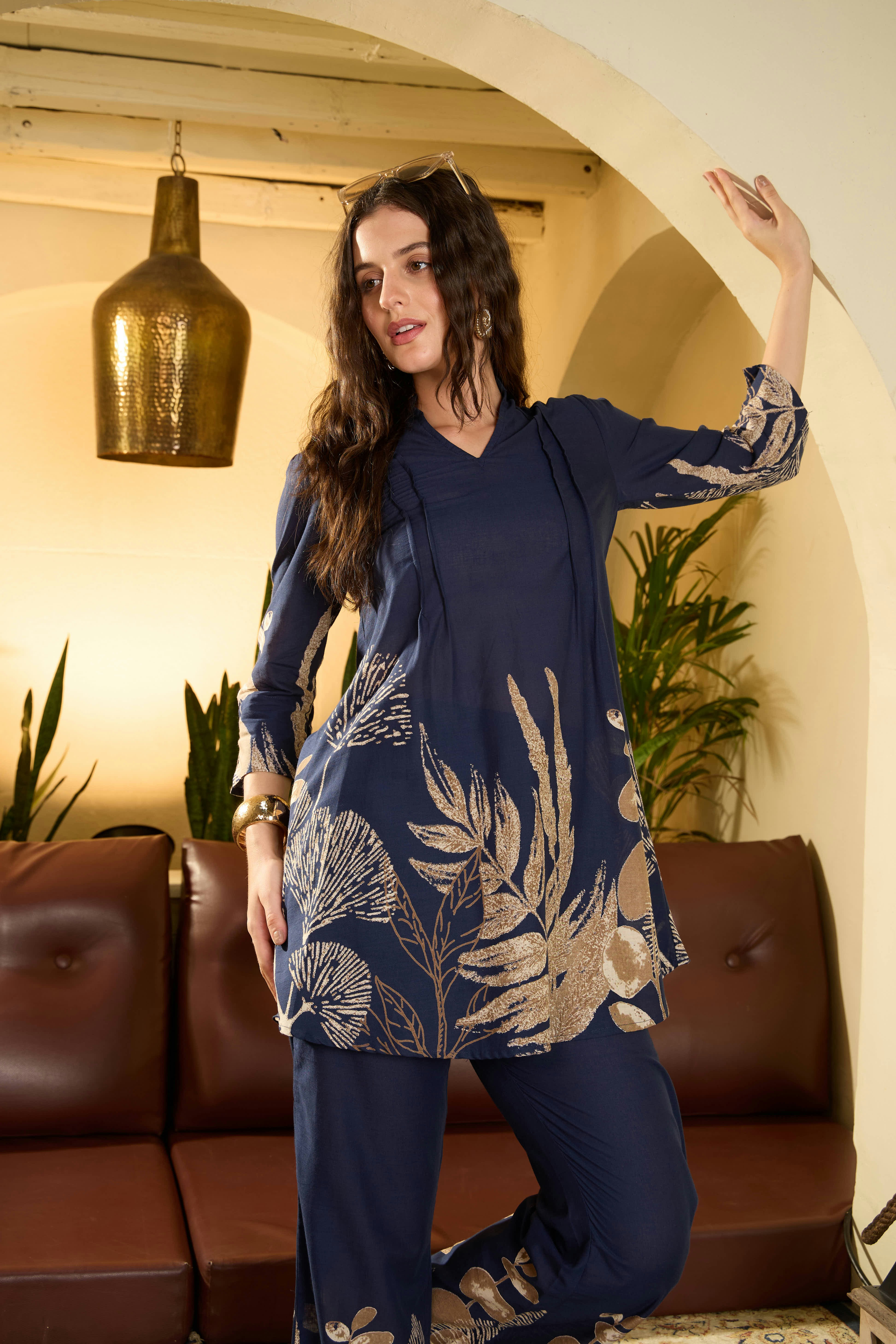 Pose in a Sunset Lounge: Graceful Poise in Indigo Floral Attire