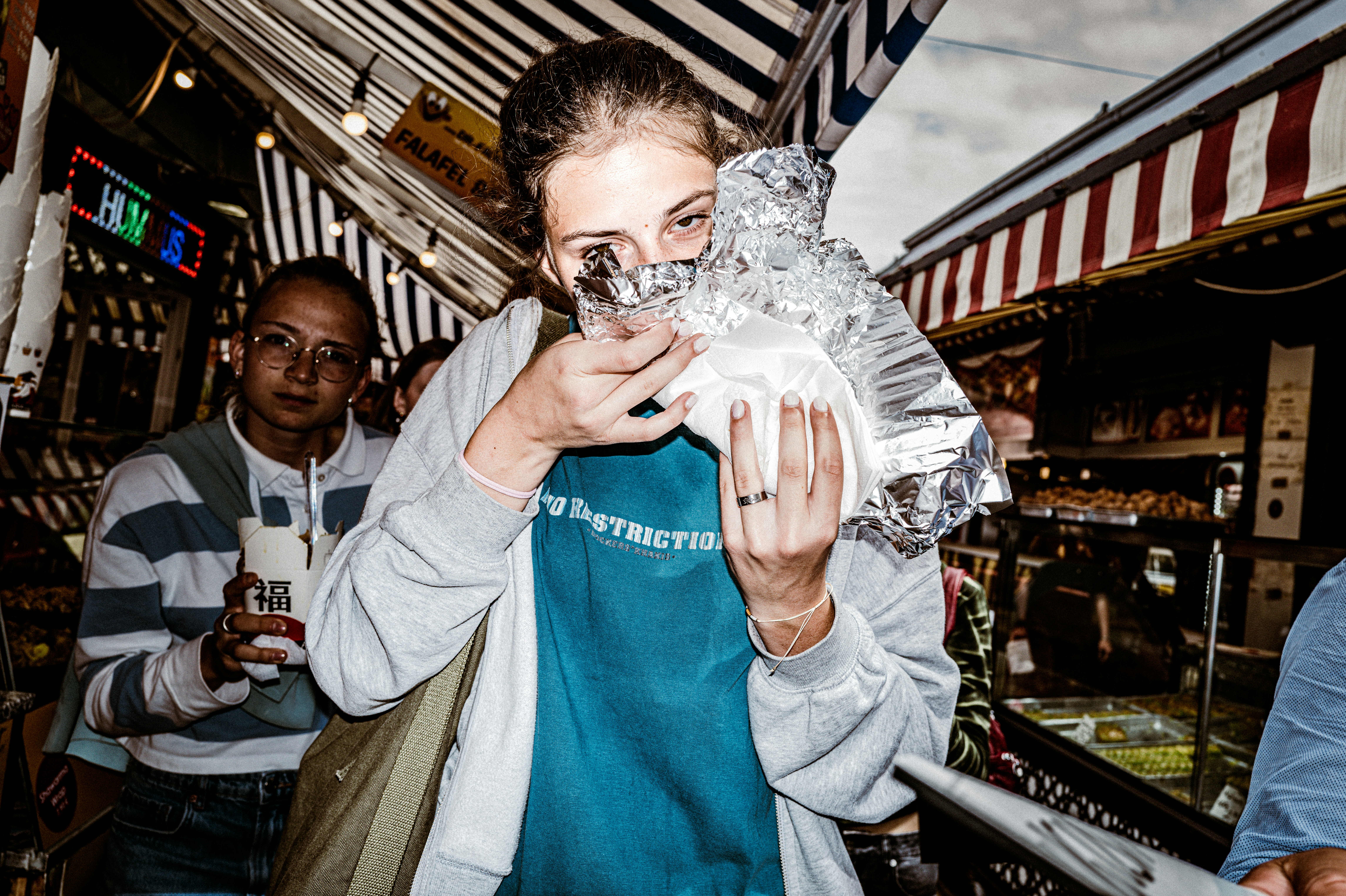 Shimmering Wrap: A Moment of Chewy Mystery at the Market Stall