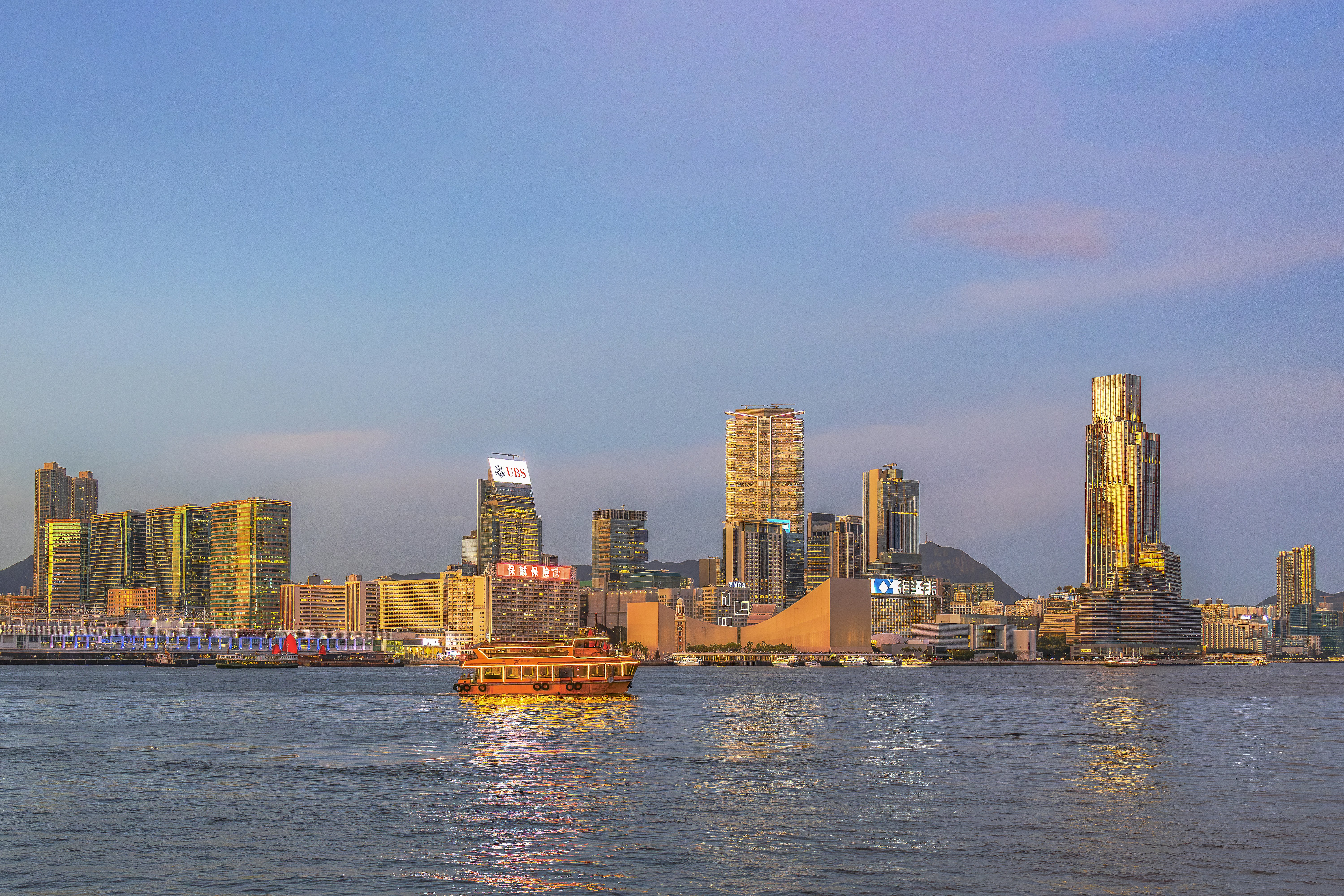 Evening Ferry Skimming the City Skyline