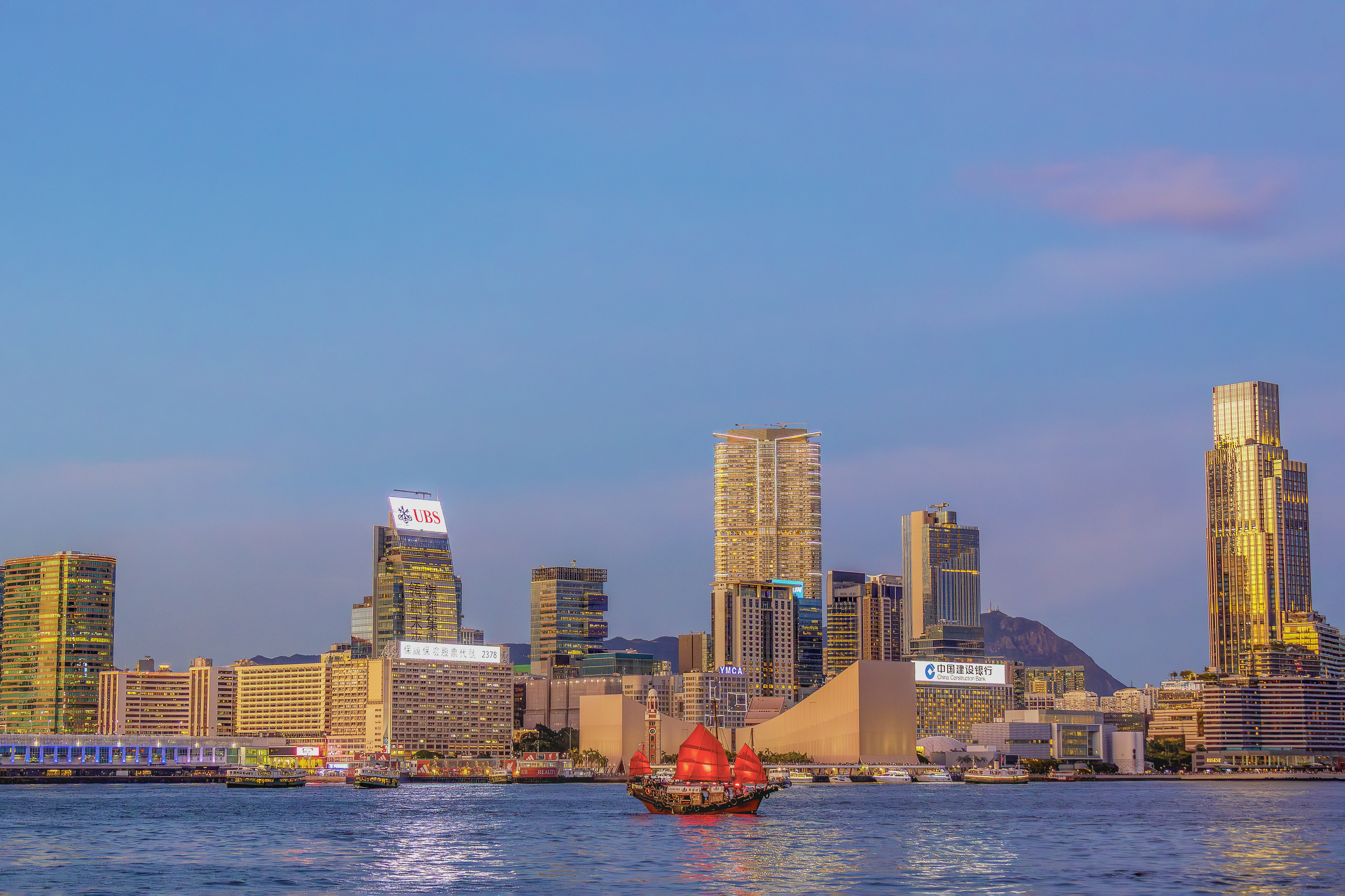 Harbor Skyline at Dusk: Boats, Glass and Golden Towers