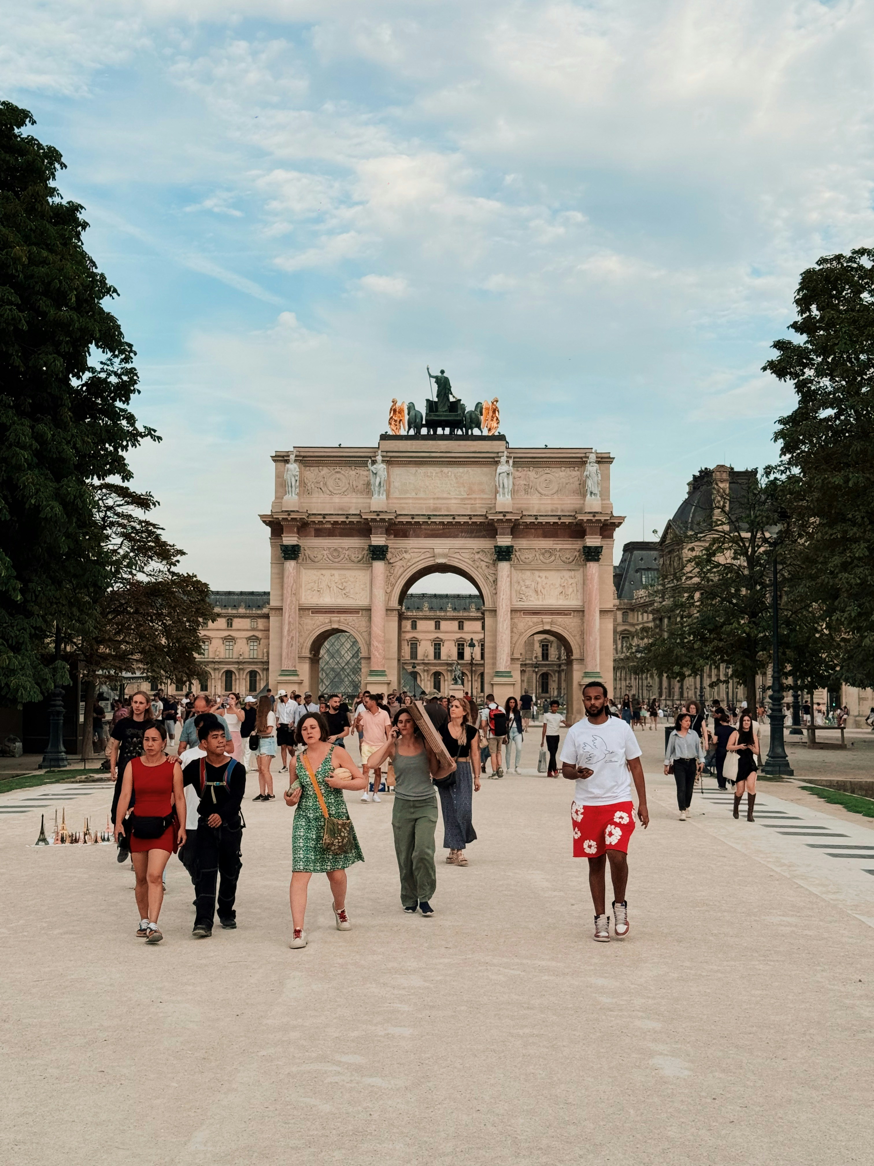 Crowd Walks Toward the Arch: A Moment at the Historical Gate