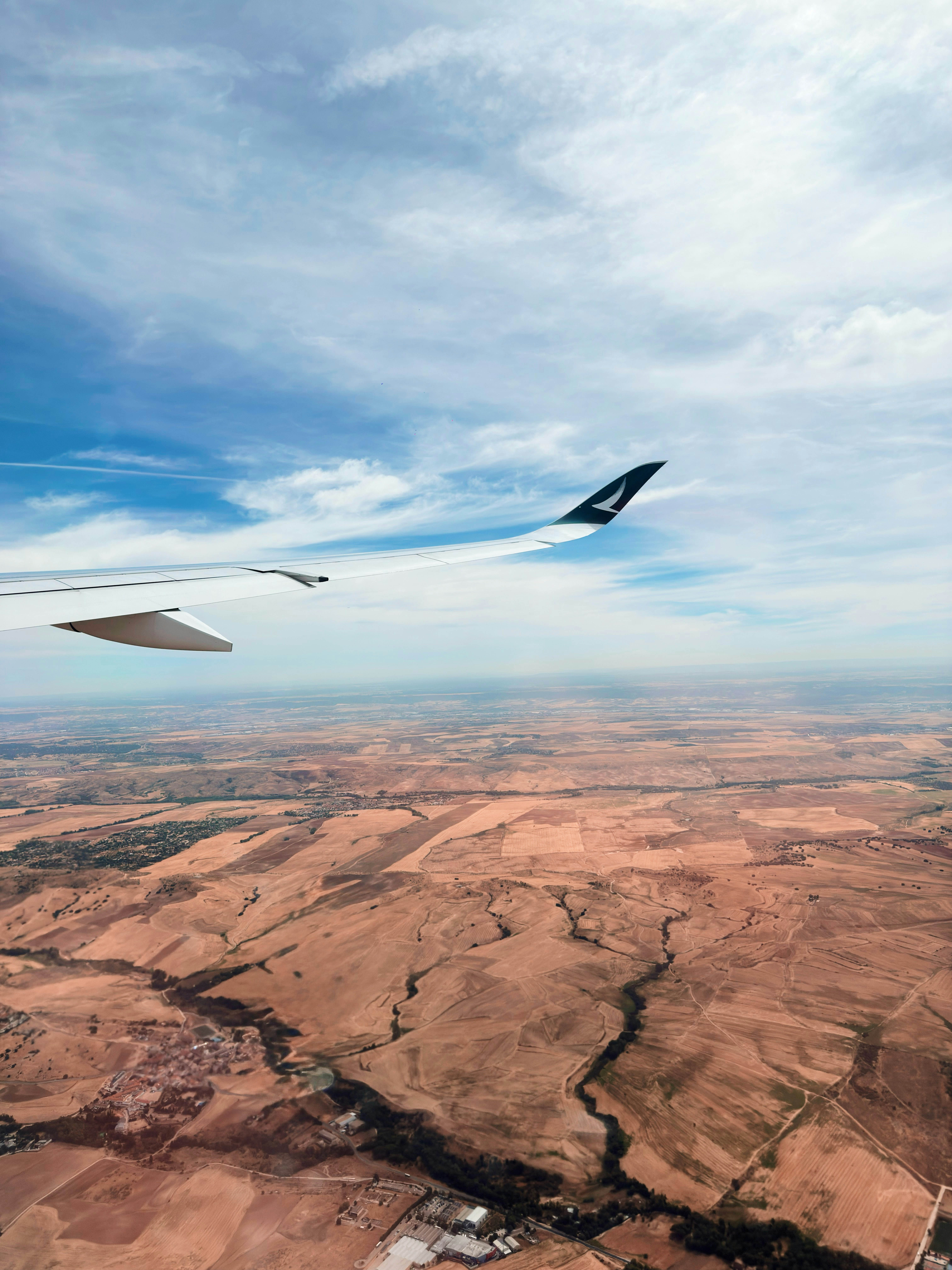 Wingtip Journey: Aerial Vistas Over Parched Landscape