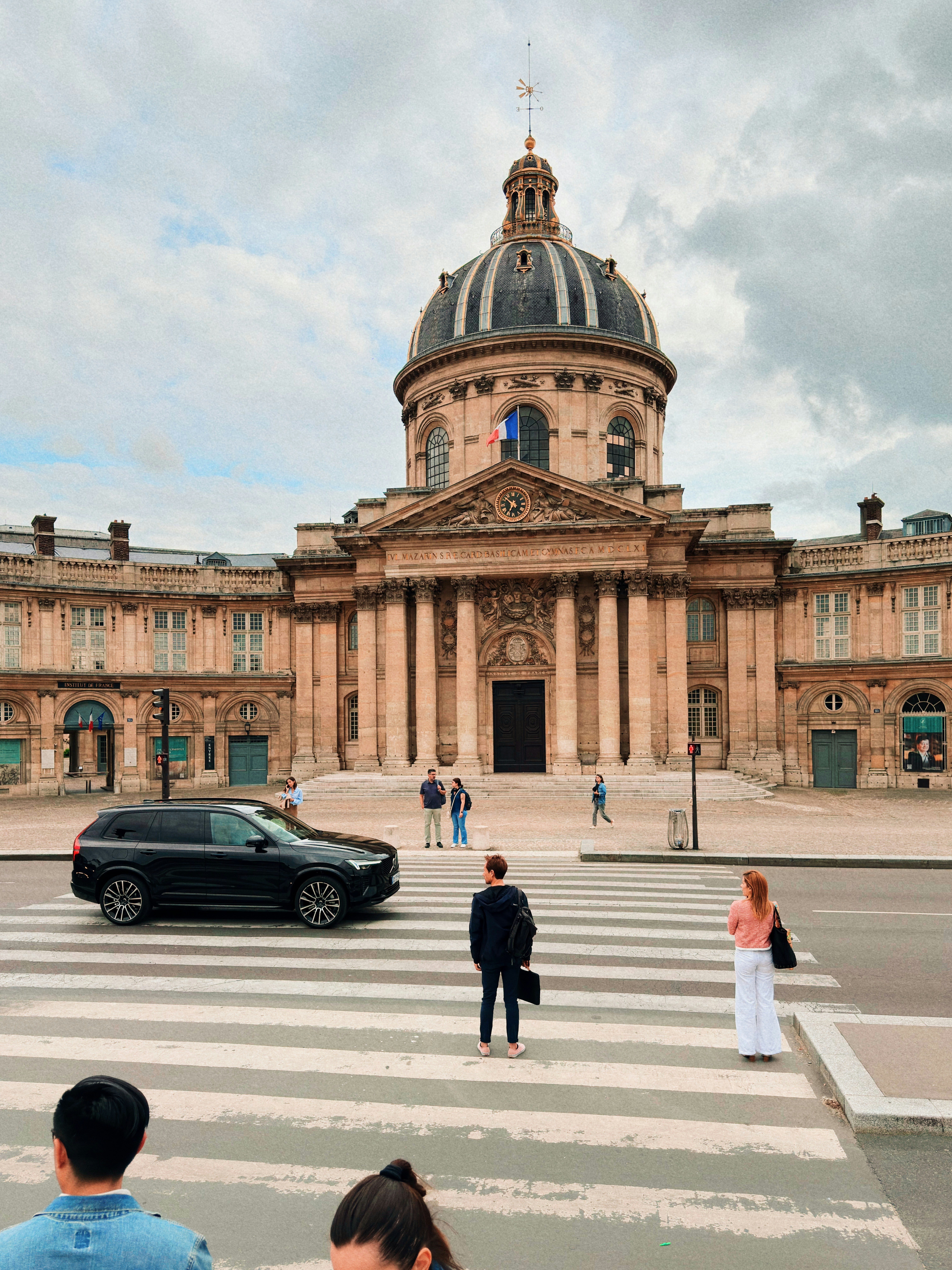 People and car at crosswalk in front of grand building photo – Free Car ...