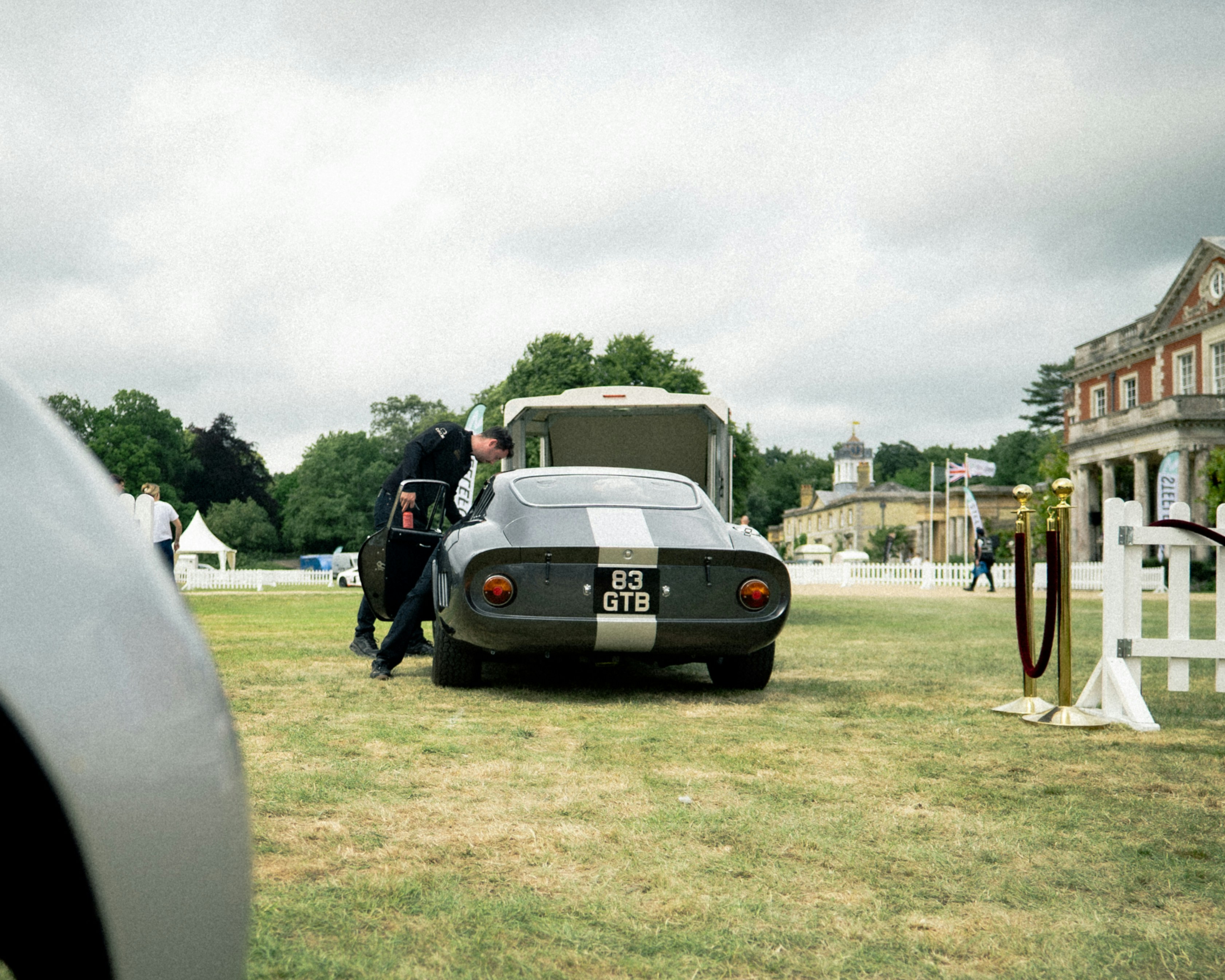 A classic Ferrari vintage sports car photographed at an outdoor car show, showcasing elegant Italian design, wire wheels, and timeless automotive craftsmanship. This image represents luxury automobiles, classic car culture, racing heritage, and retro sports car design, captured in natural daylight at a concours-style event.