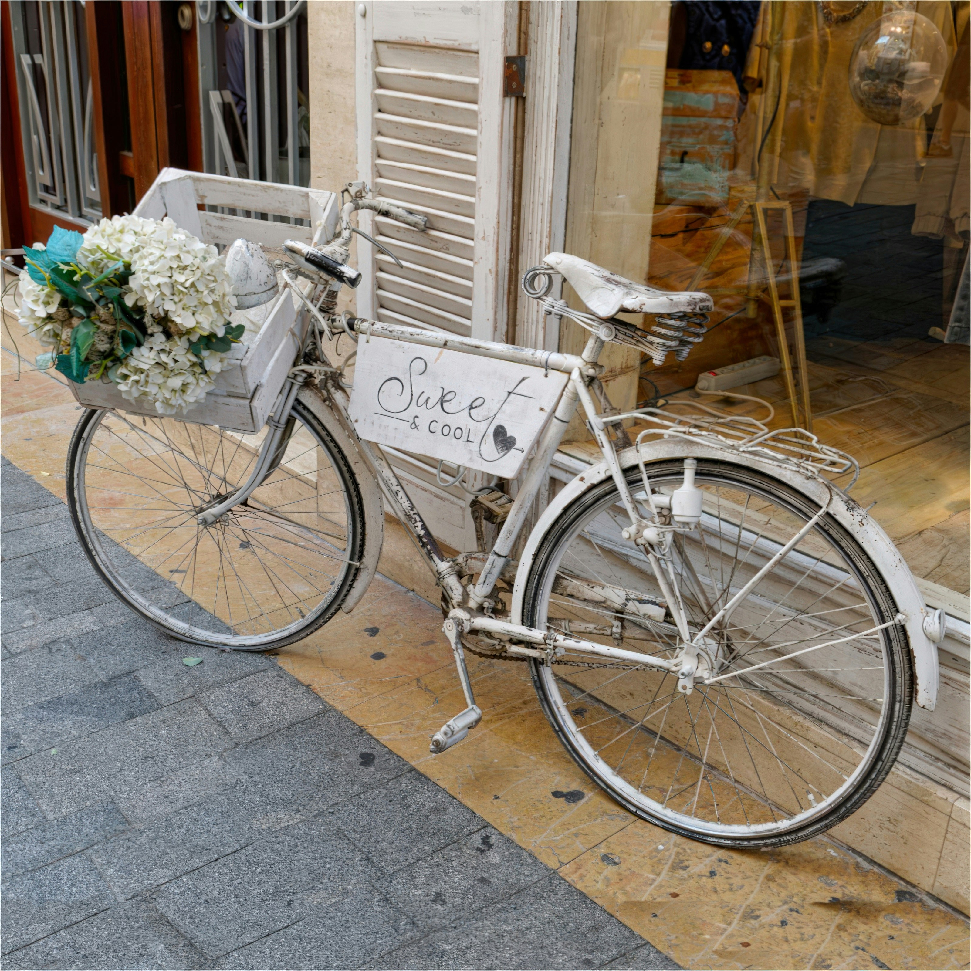 Pastel Pedal Studio: A Delicate White Bicycle in a Quiet Shopfront
