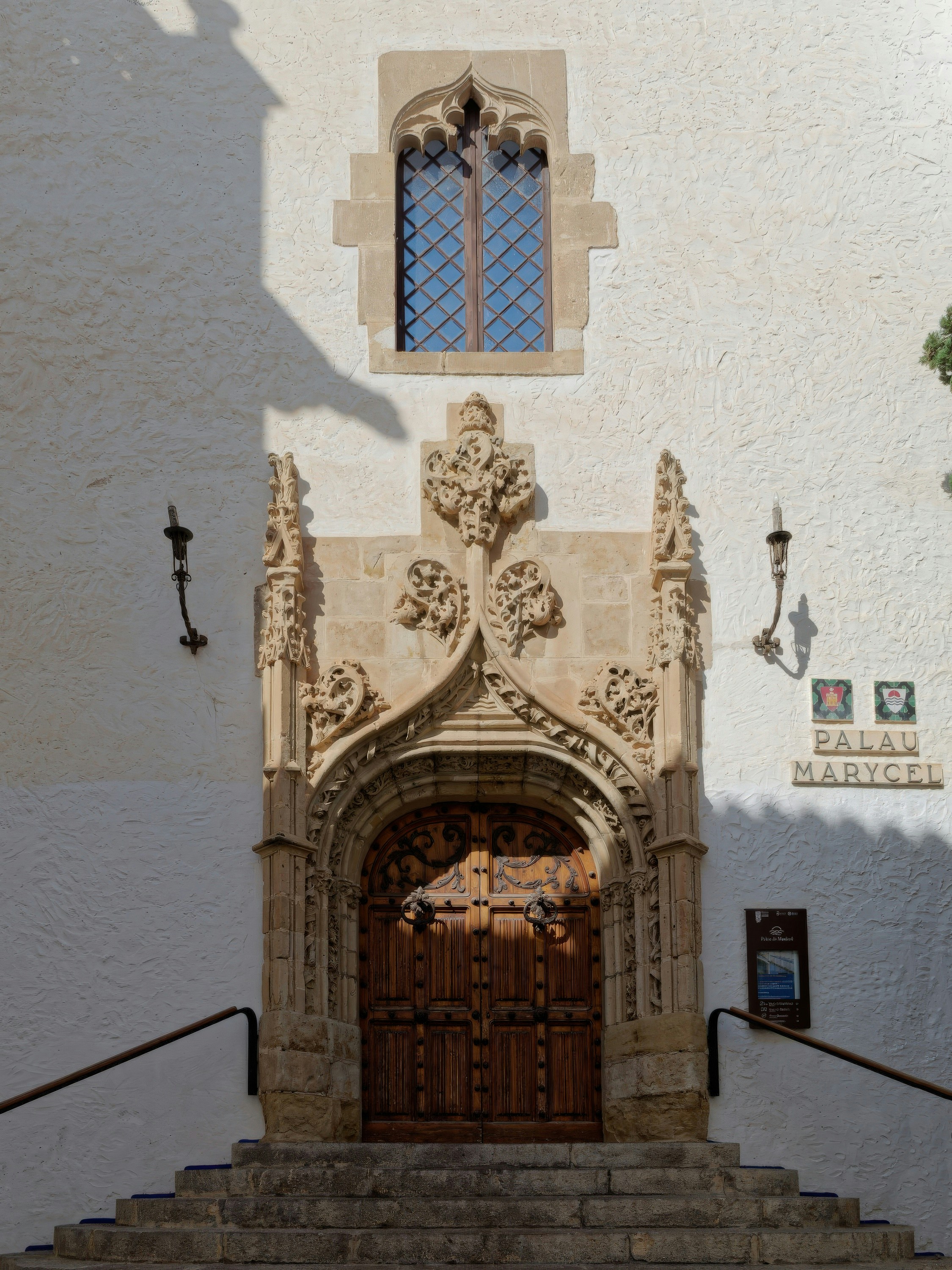 Ornate wooden door with gothic architectural details