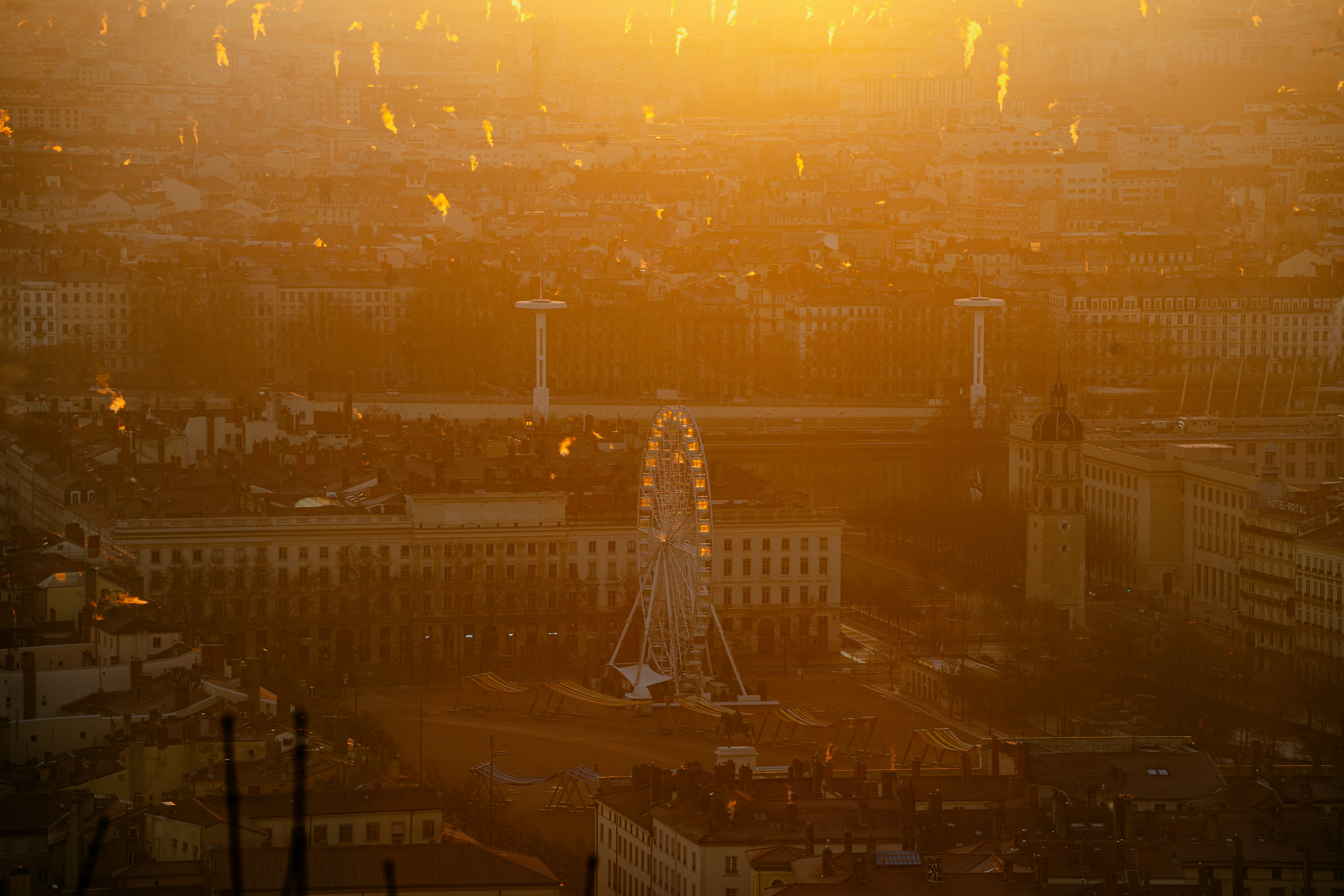 City Sunset Over a Quiet Ferris Wheel