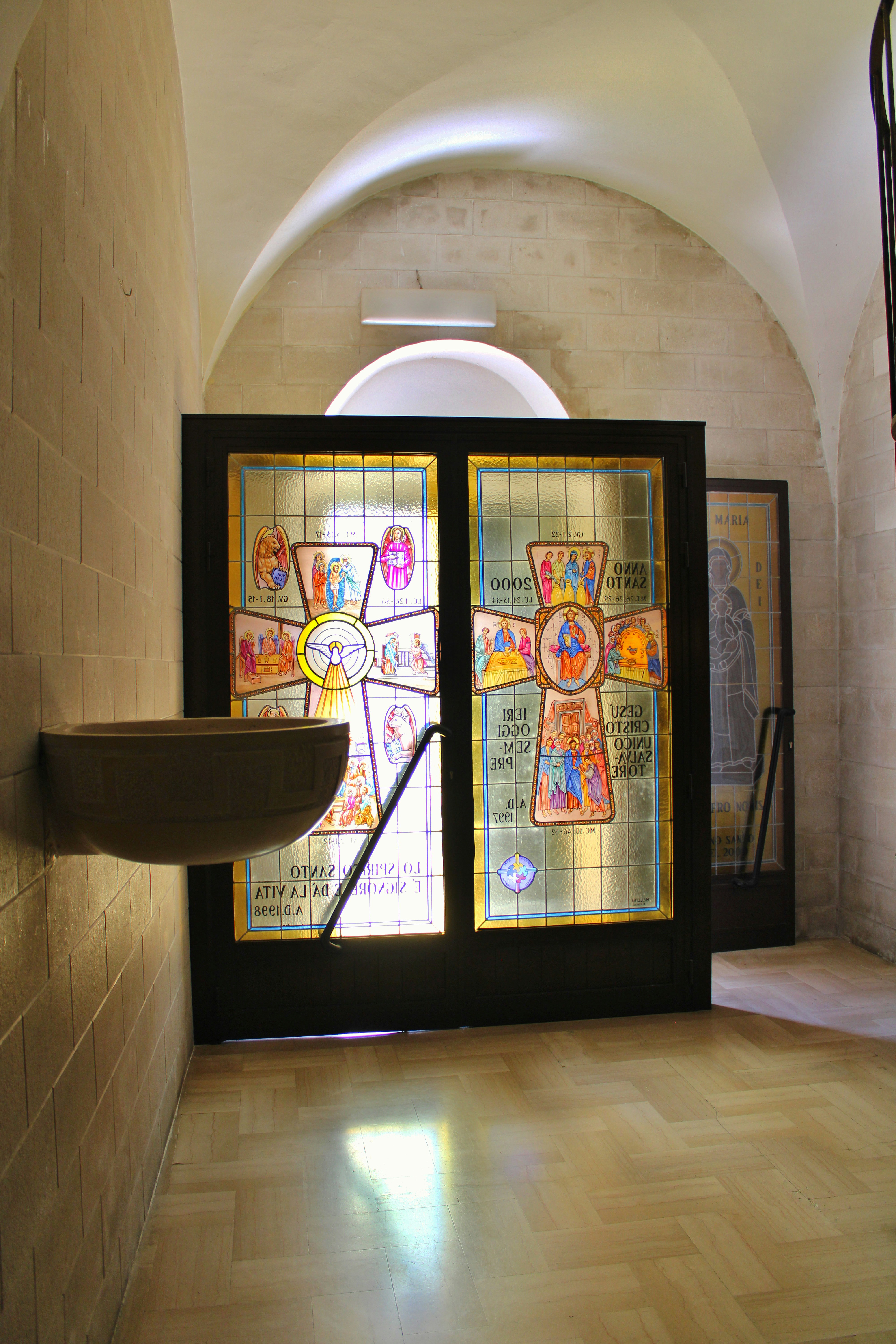Stained Glass Doorways in a Quiet Arcaded Hall