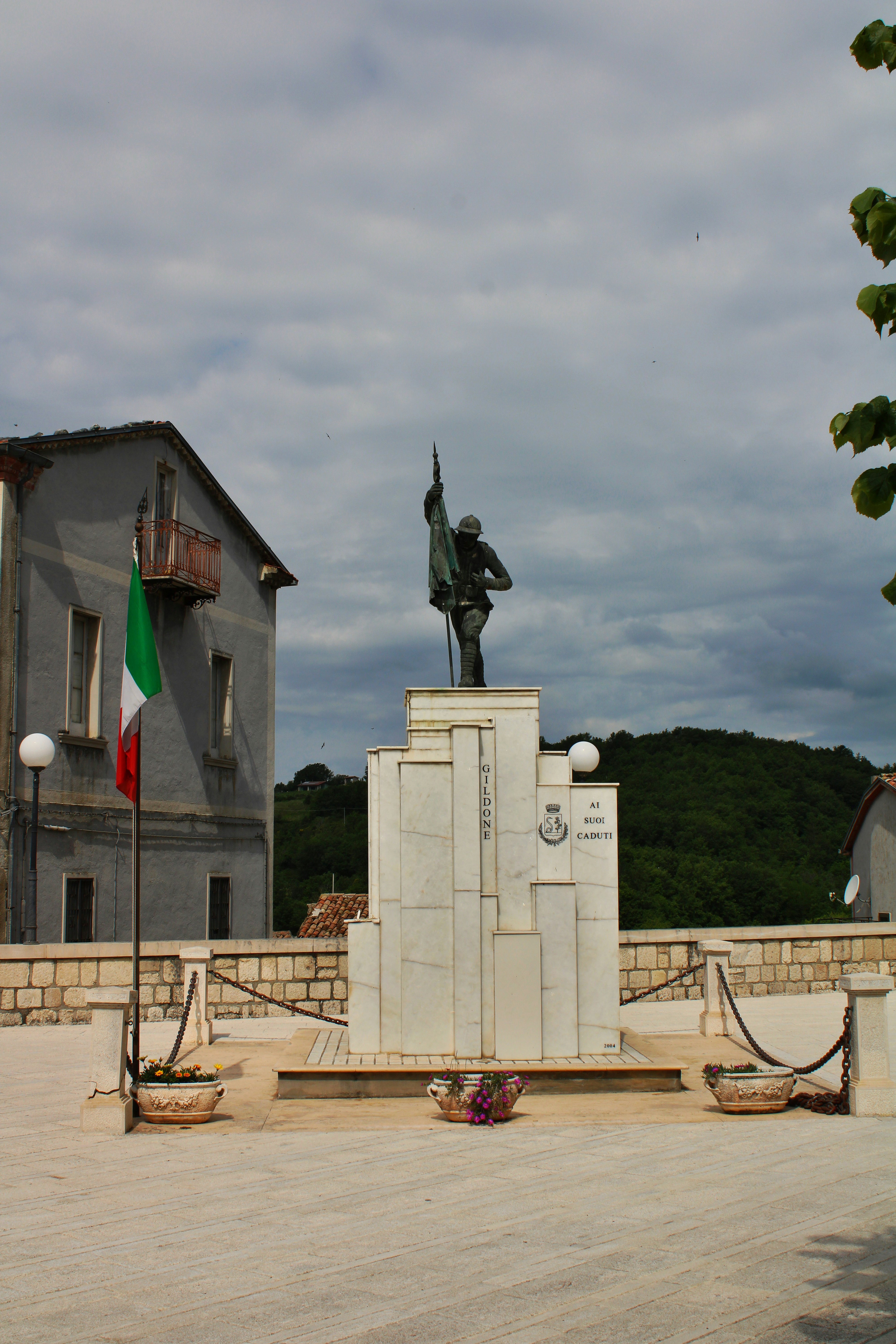 Monumental Gaze: A Bronze Hero Standing Over Marble Steps