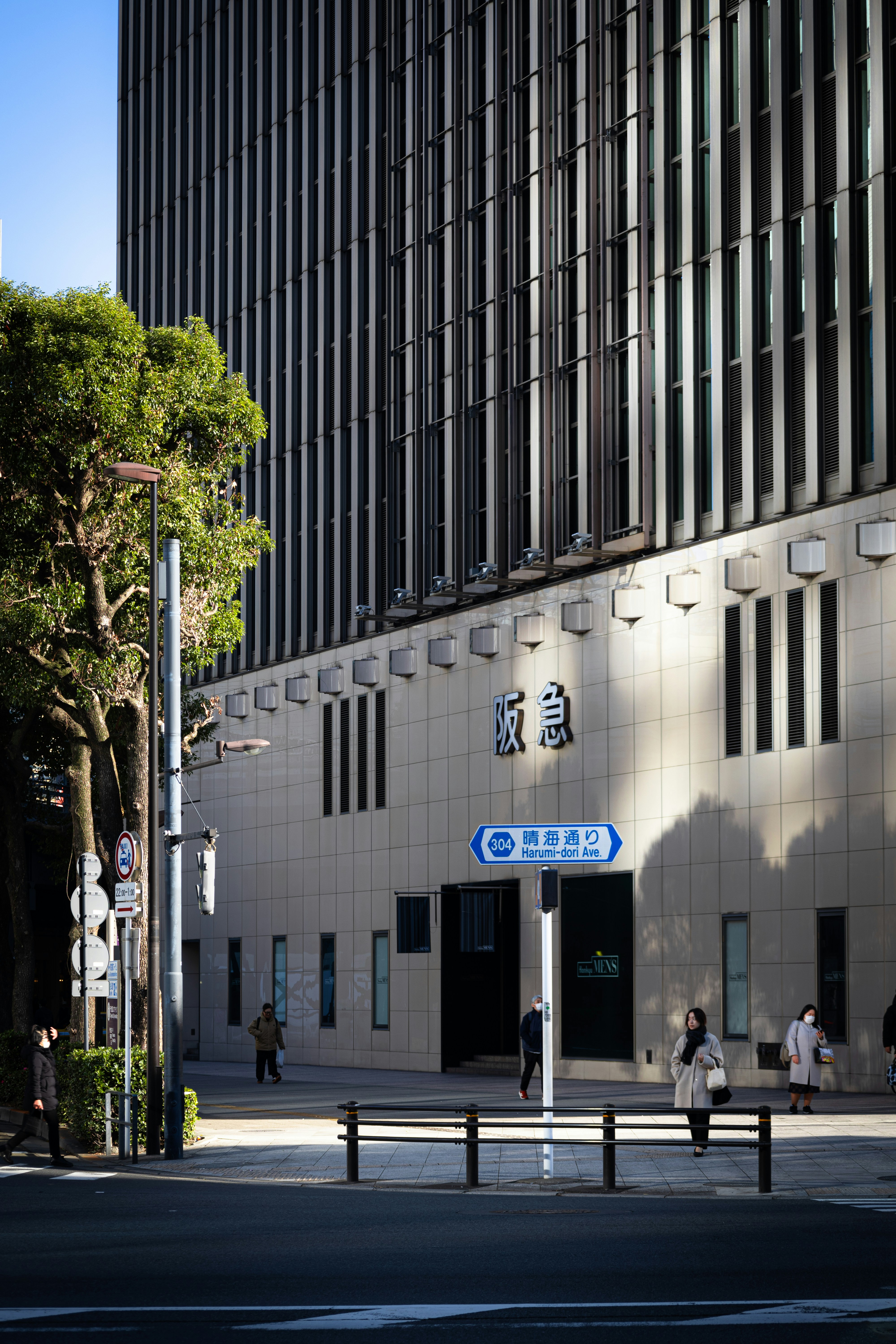 Urban Facade and Street Sign: Tokyo-Style Exit into Light and Shadow