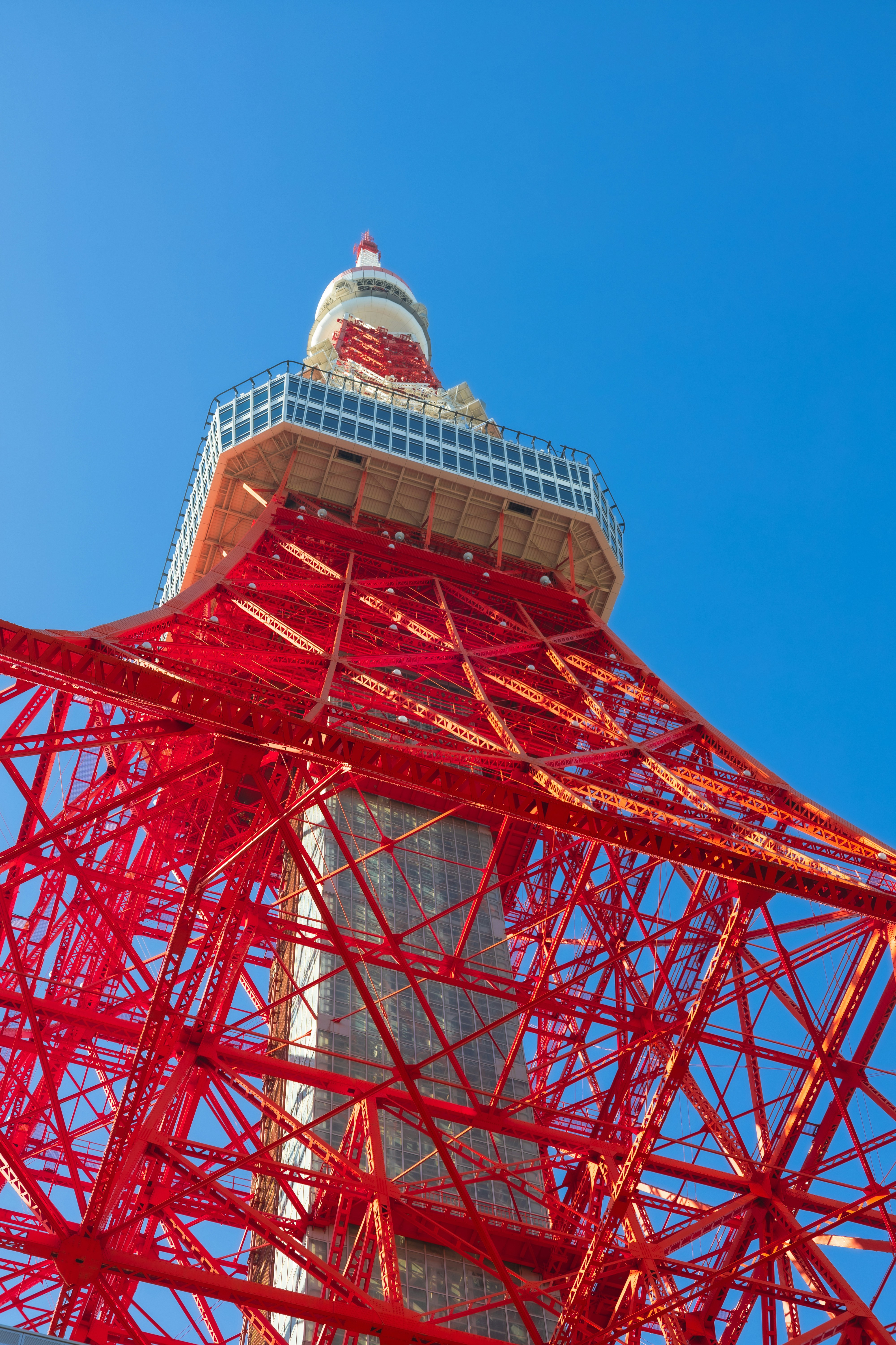 Crimson lattice meets sky: Tokyo Tower's Iron Skeleton Reaching Up