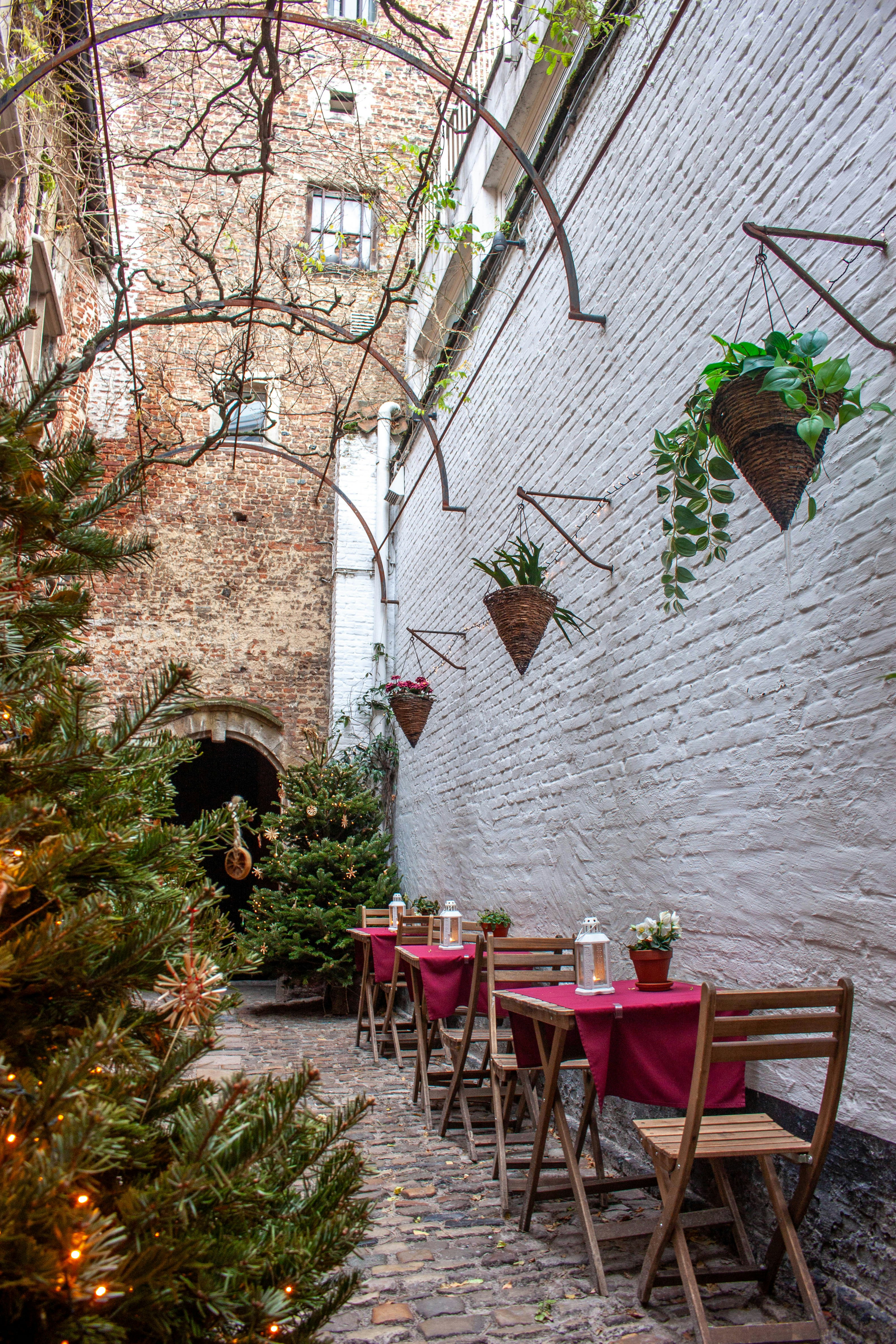 Cobbled Alley Bistro: String Lights, Greenery, and Velvet Tables