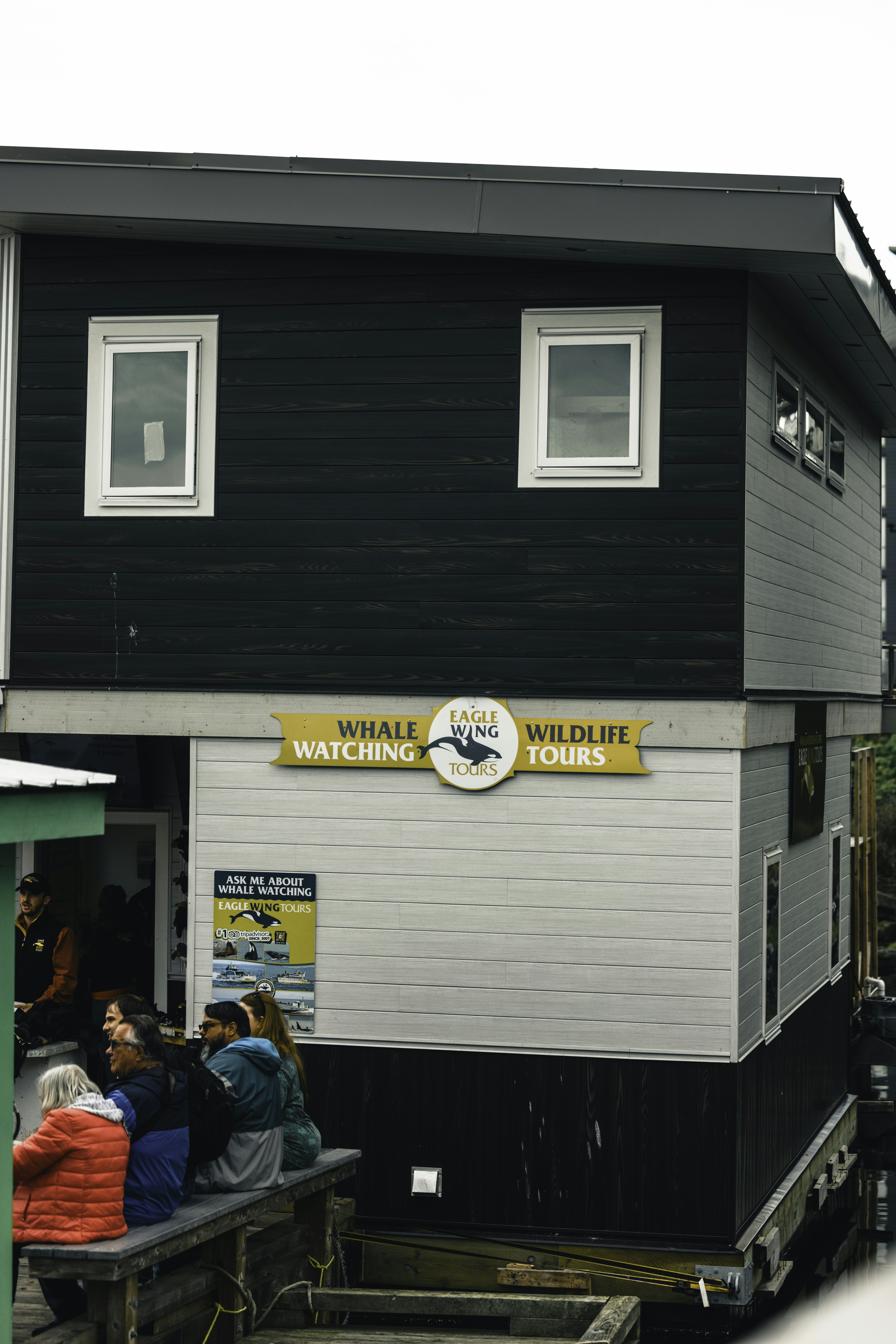 Waterside Watcher: People on the Deck of a Whale-Watching Hub