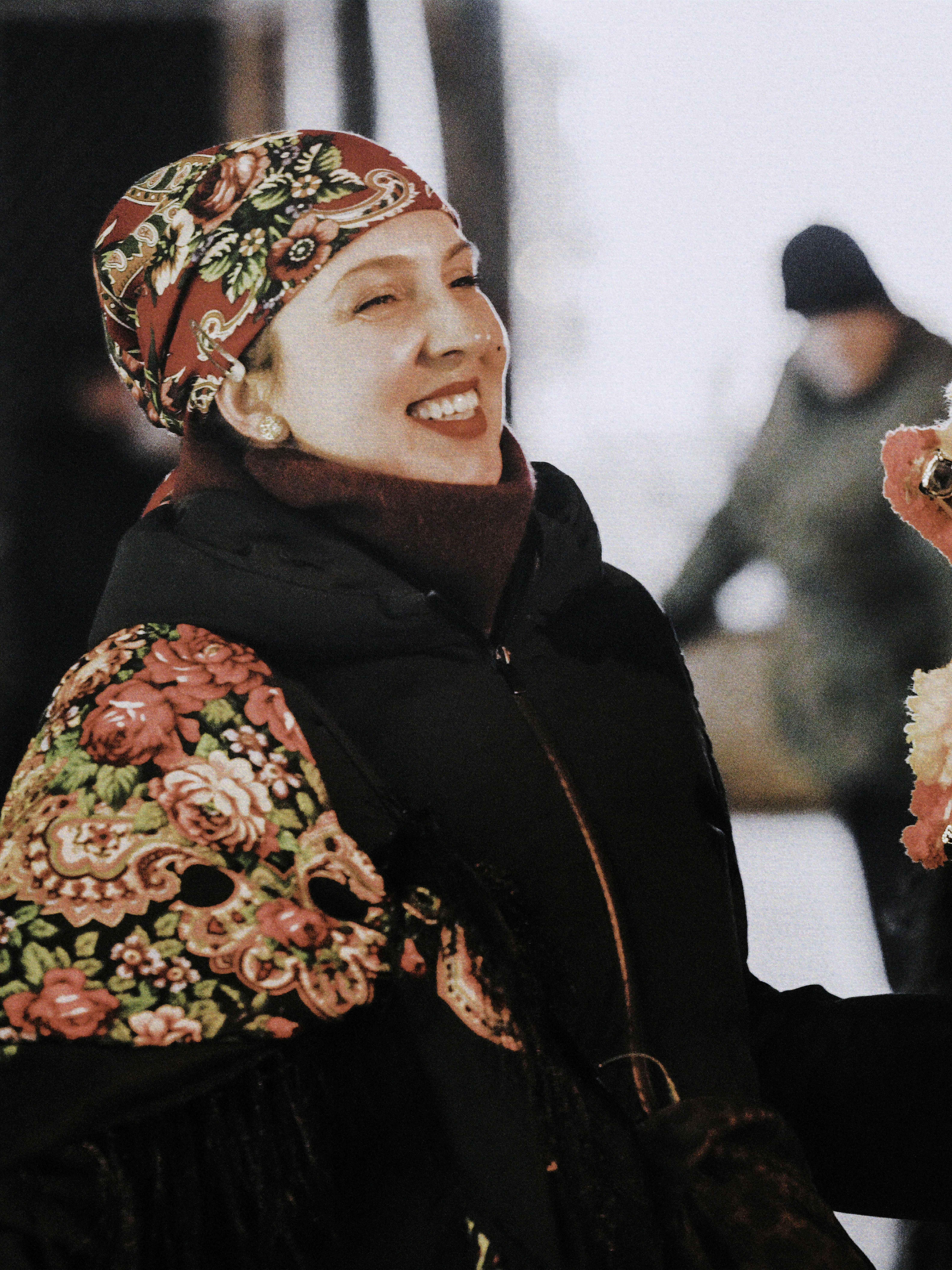 Smiling in Folk-Patterned Winter Attire