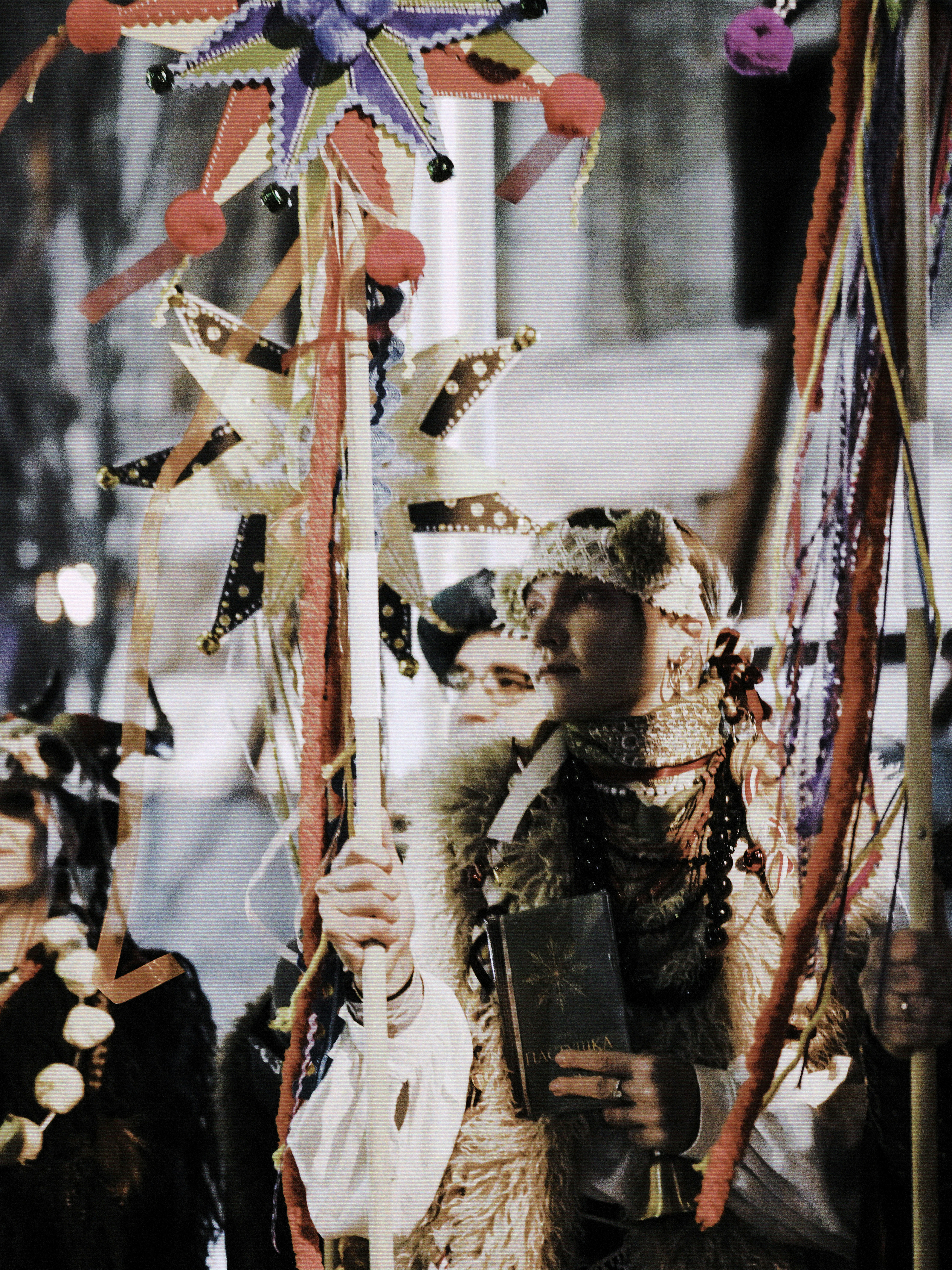 March of Paper Stars: A Costumed Parade Amid Festive Ribbons