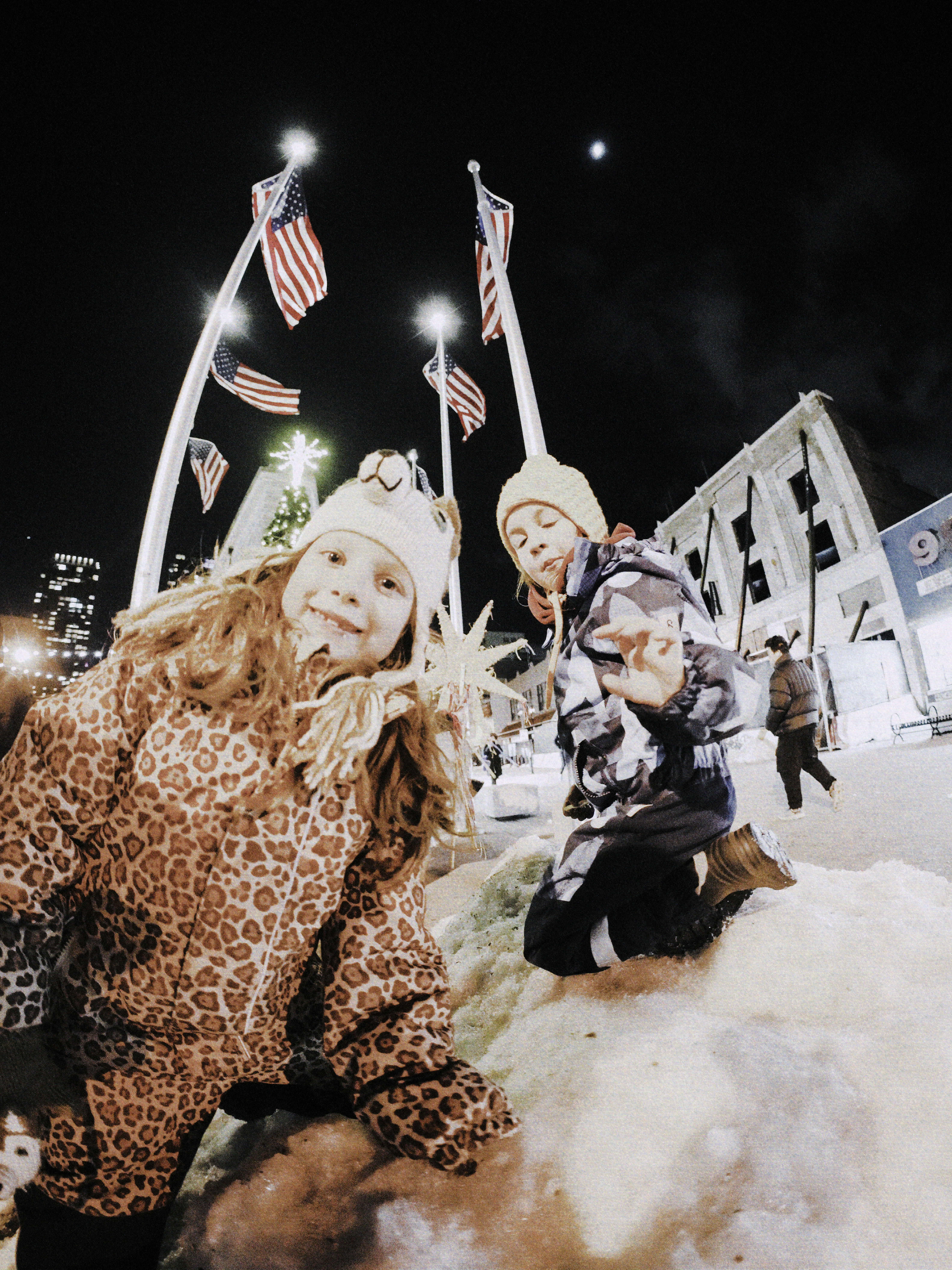  festive night at the holiday plaza: kids at the snowlit parade