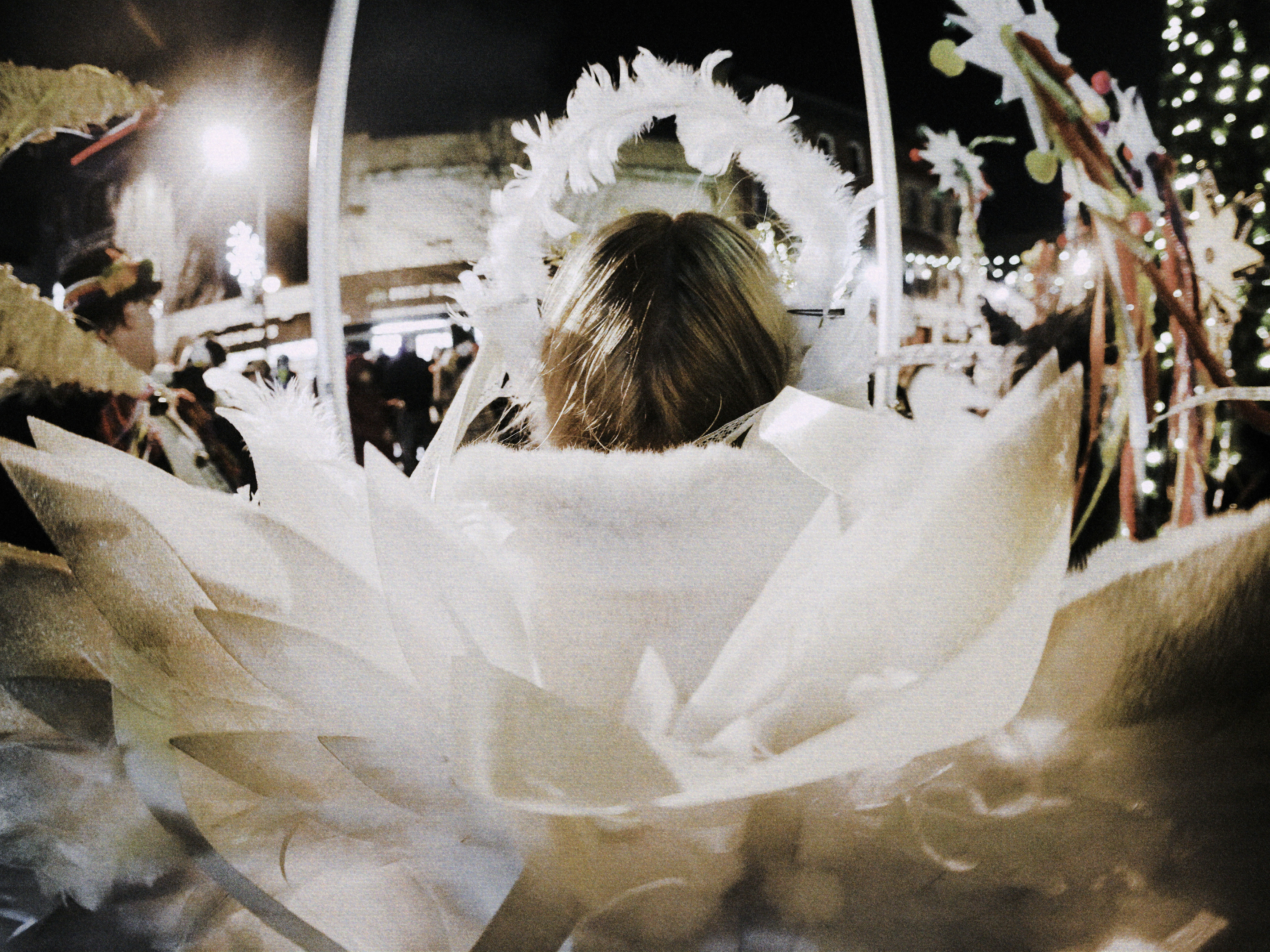 A vibrant street photography series by Olek Buzunov (@buzunov.photoart) capturing a Ukrainian Vertep folk performance in Jersey City in 2025. These images document a traditional Ukrainian Christmas procession featuring handcrafted star lanterns, embroidered costumes, ritual masks, and carolers moving through an urban American setting. Shot at night in a crowded public square, the photos blend cultural heritage with modern city life, highlighting the energy, color, and emotion of a living immigrant tradition. The collection showcases Ukrainian folklore, diaspora identity