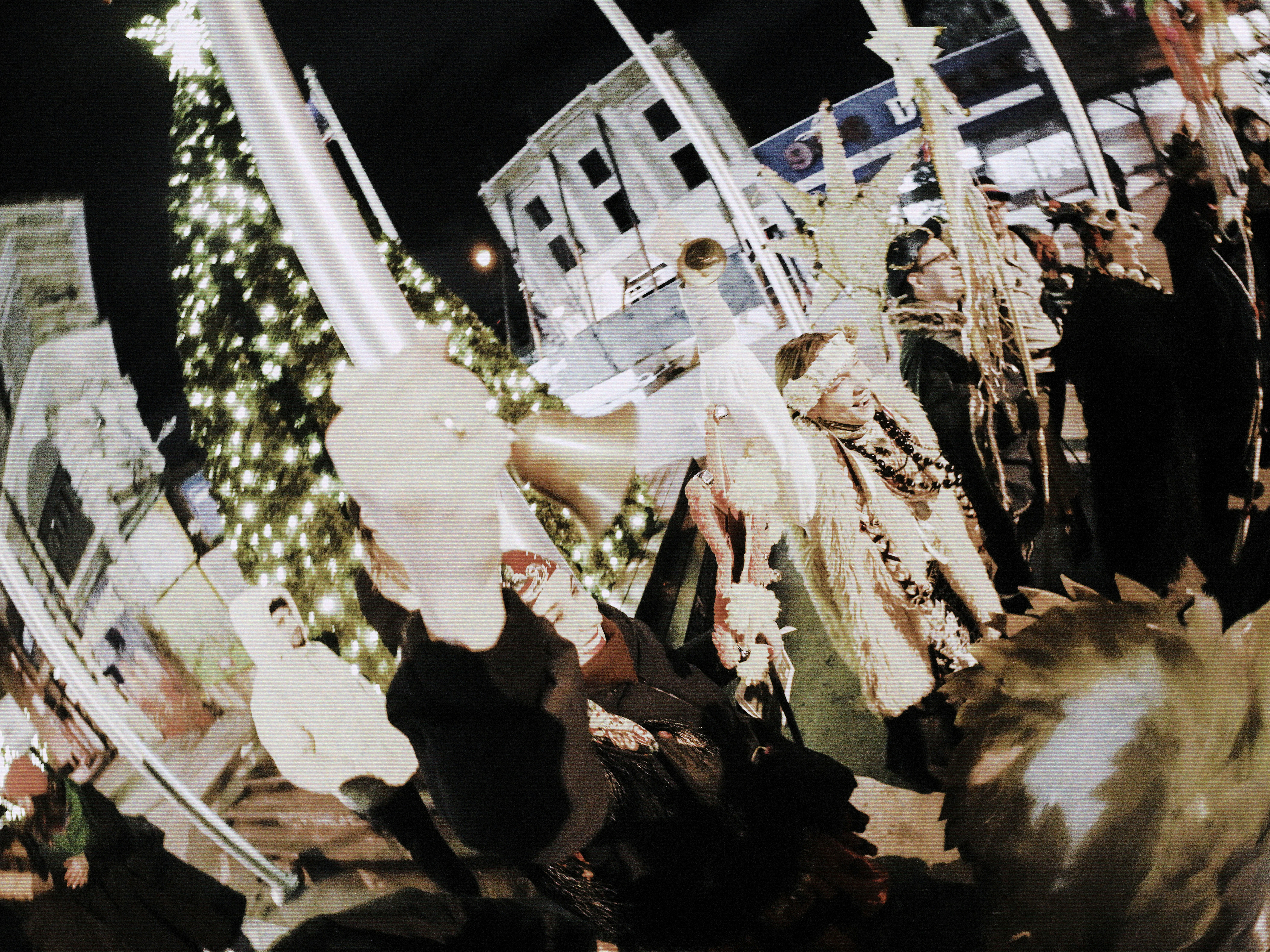 Night Carnival Spotlight: Faces in Motion under Holiday Lights