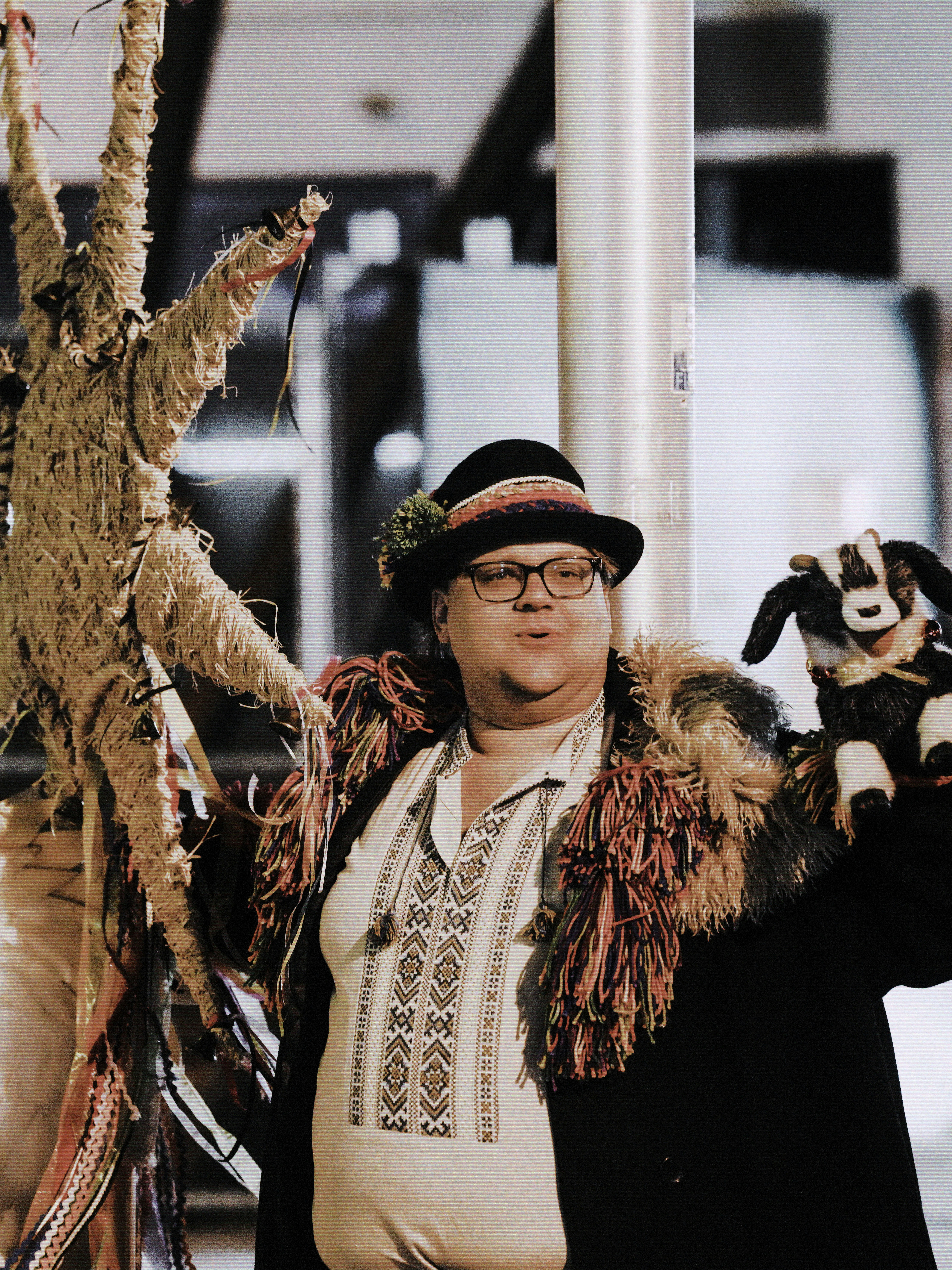 Festive performance with feathered garb and a charismatic host
