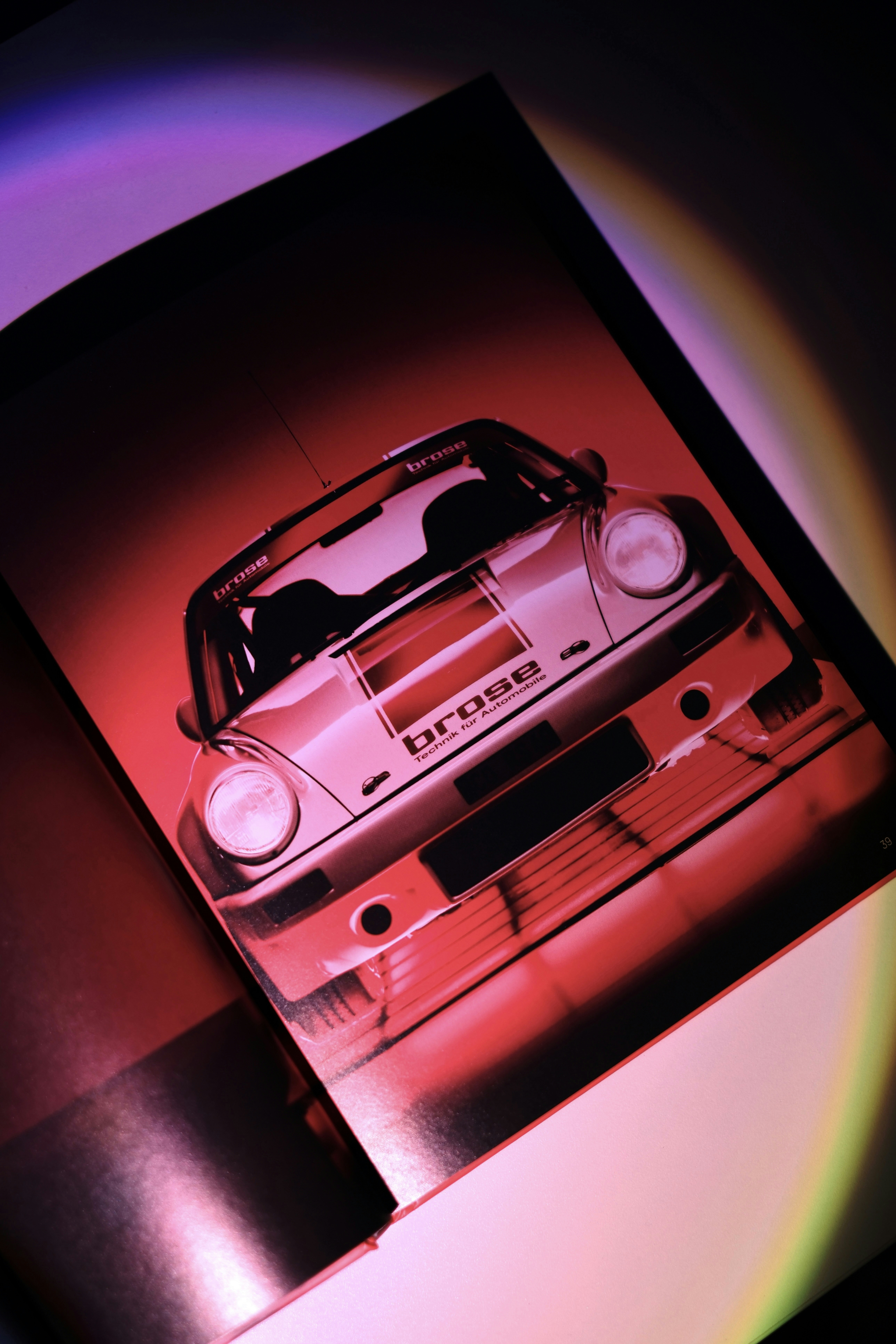 Red Porsche Portrait: A tilted glossy print under neon glow