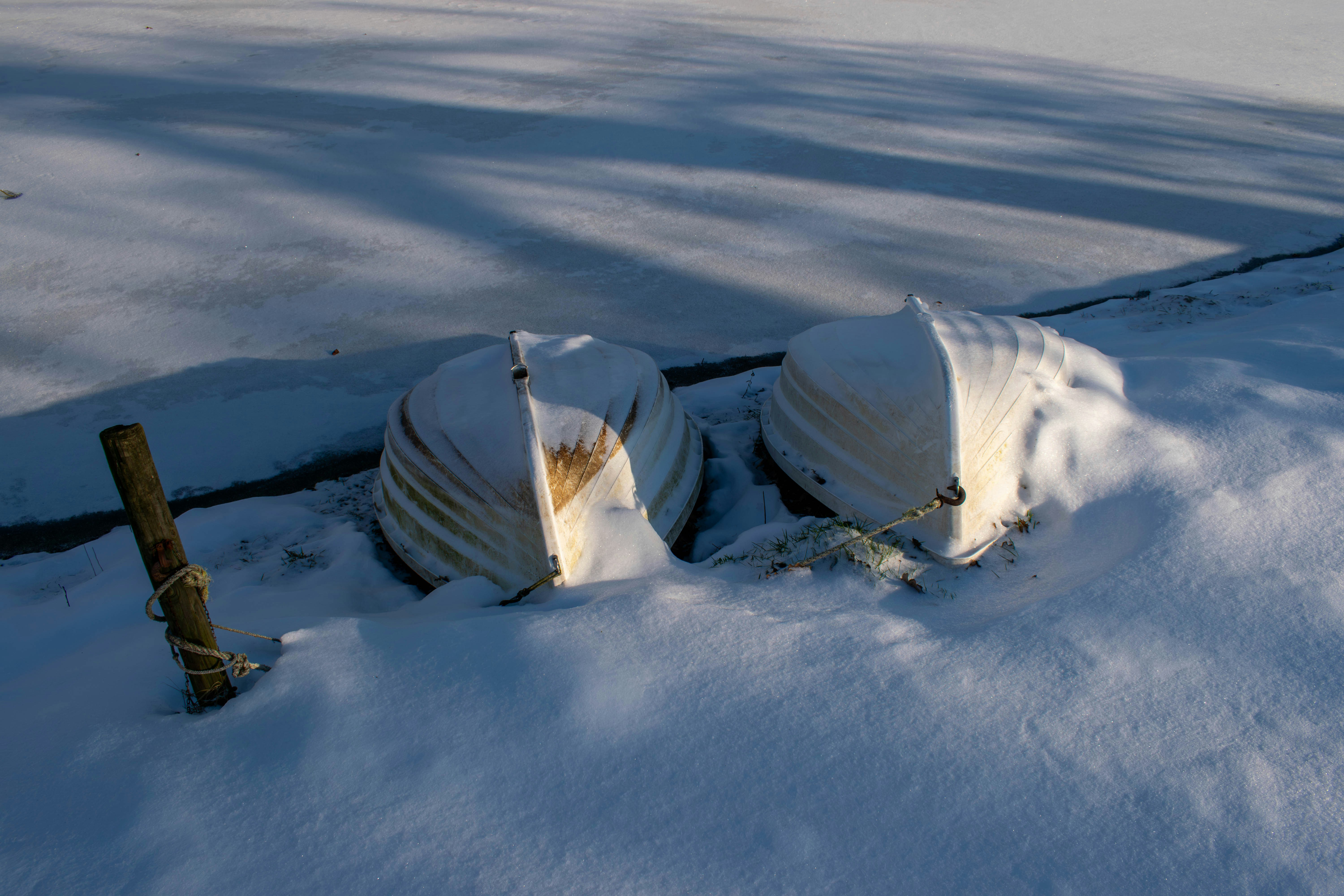 Snowbound Hydration: Two white domes Half-Encased in Winter Snow