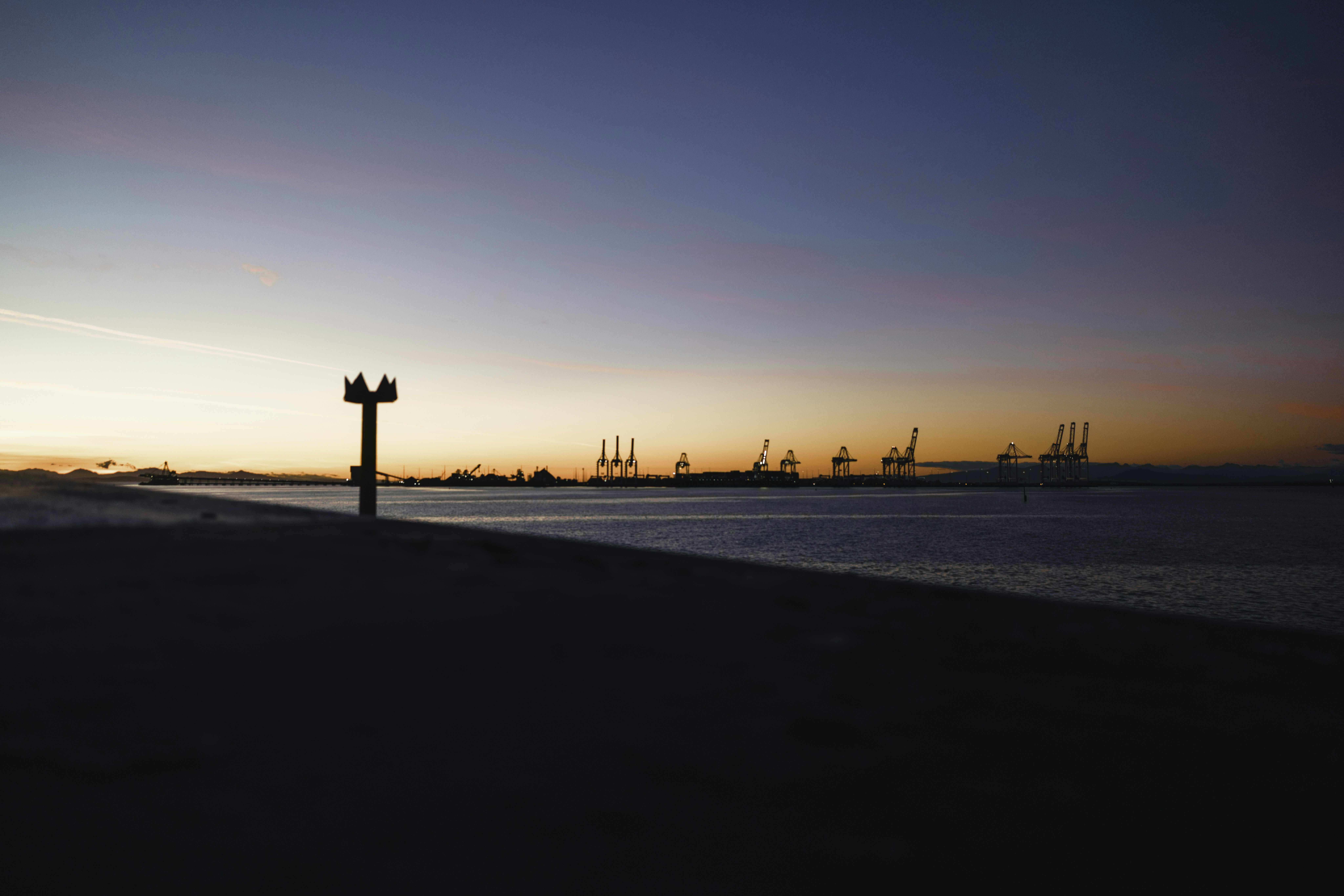 Distant Crane Row at Sunset