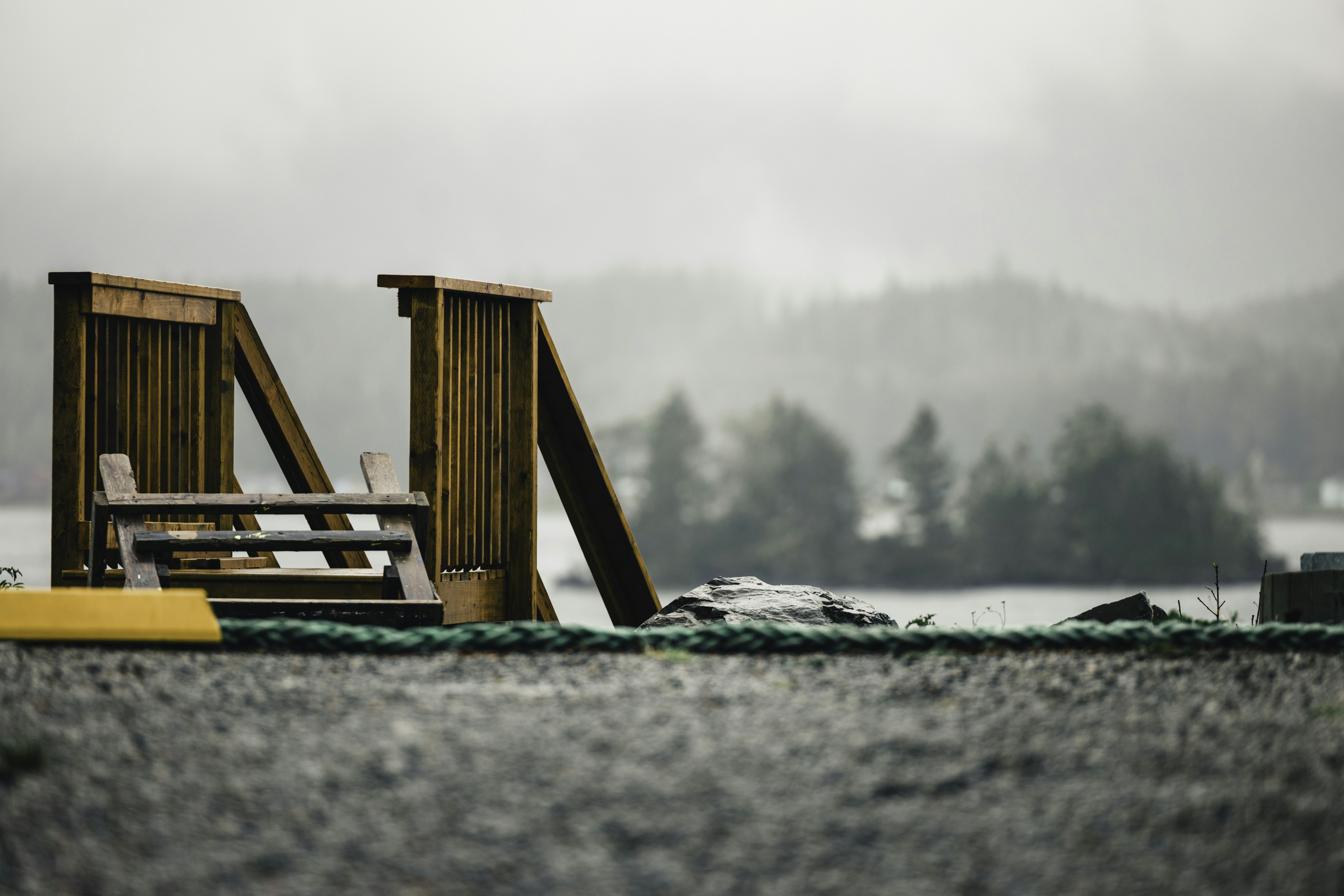 Weathered Wooden Ramps by a Misty Waterline