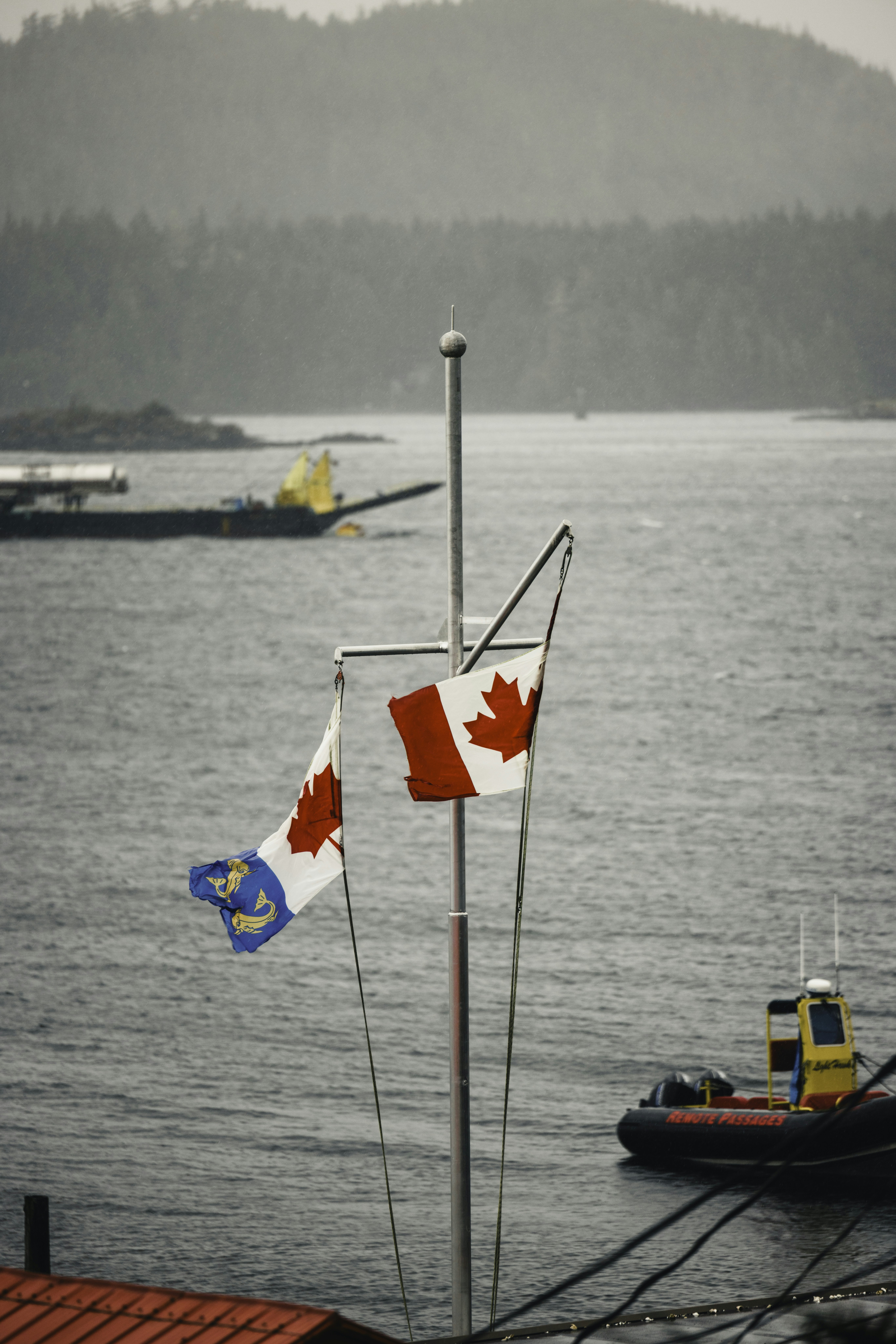 Canadian Flags at the Pier: Flags, Ship, and Calm Harbor