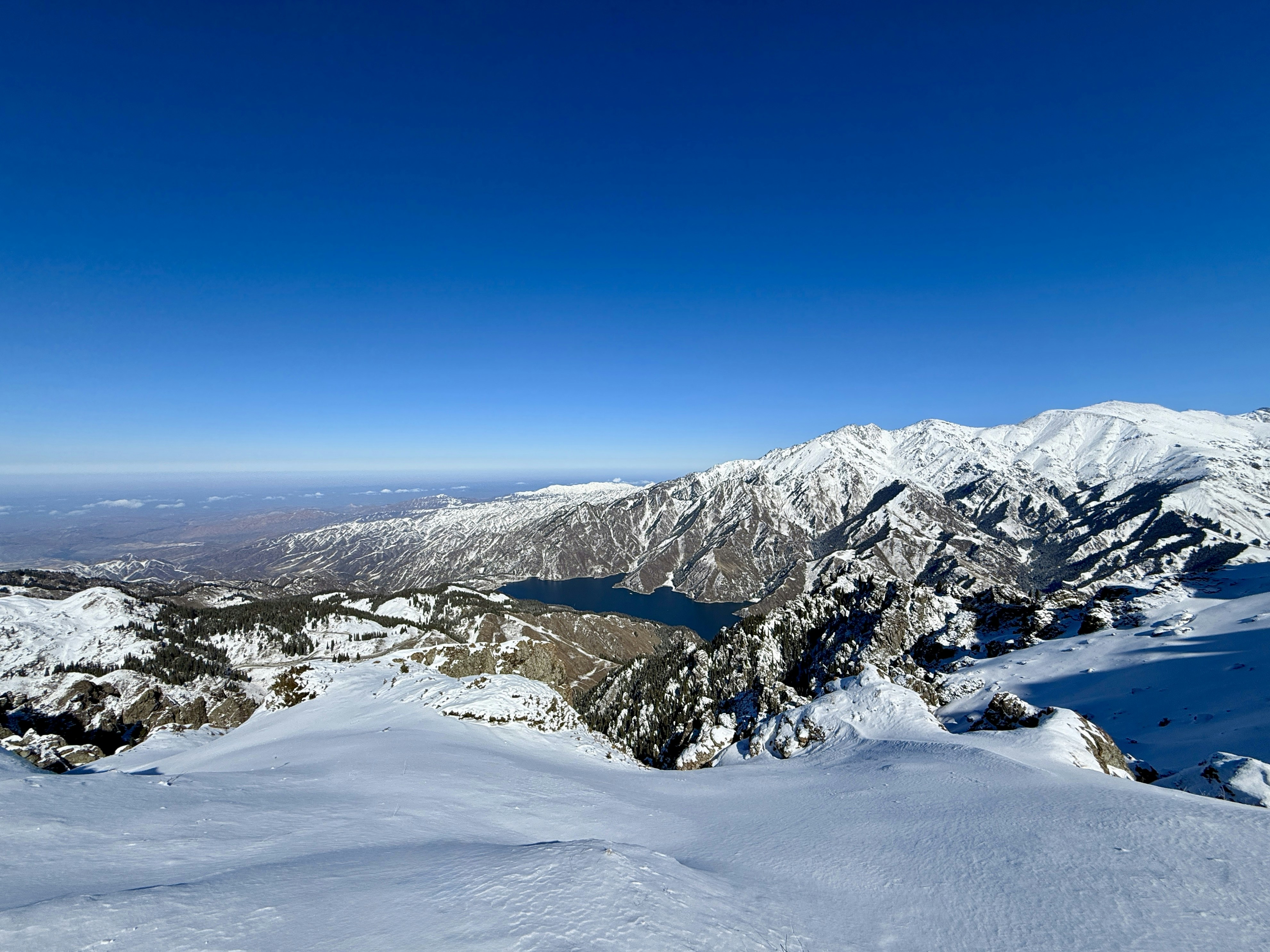 Snow‑kissed Ridge Over Blue Hinterlands