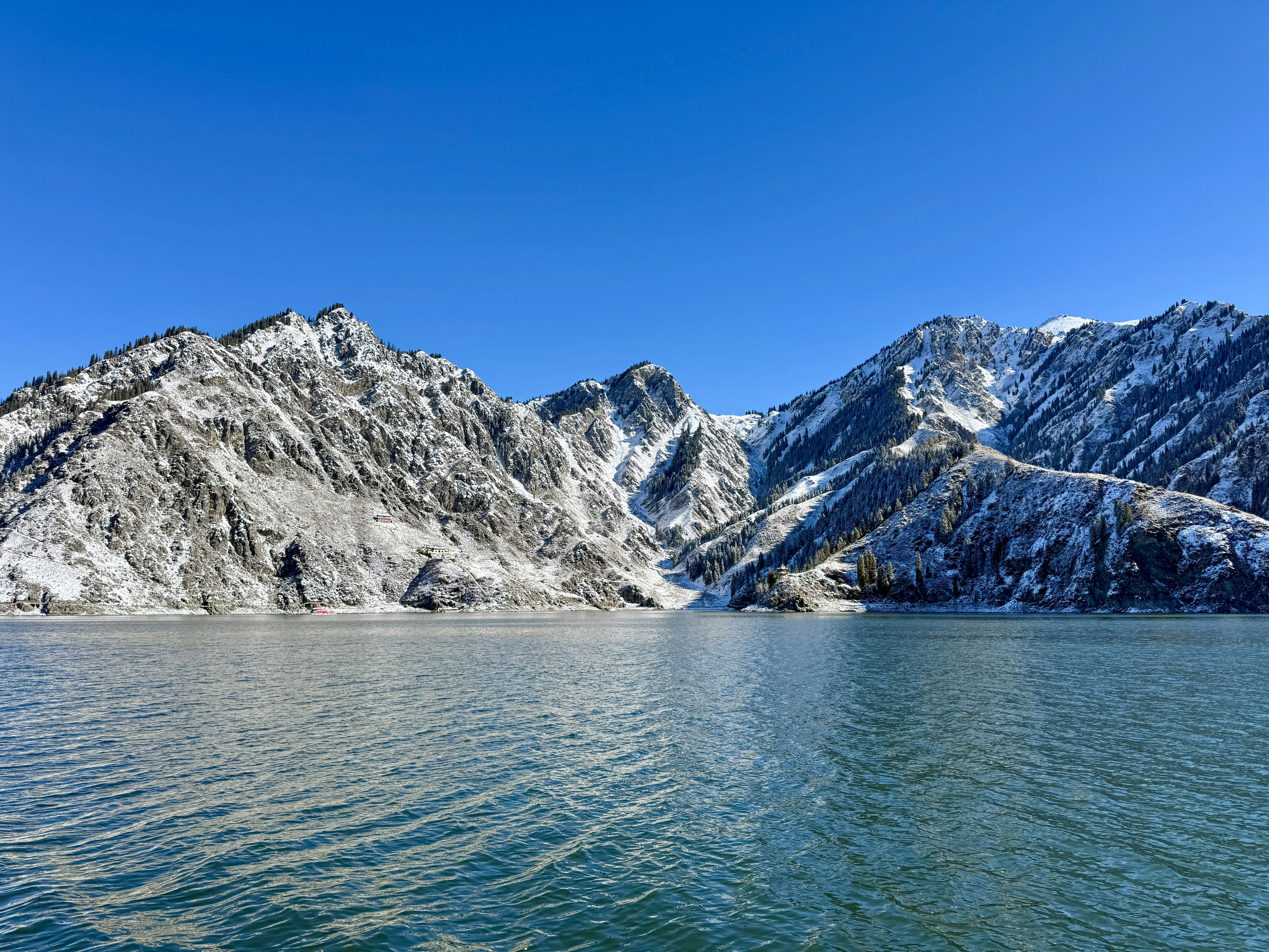 Snow-capped Ridge Reflections Across a Calm Alpine Lake