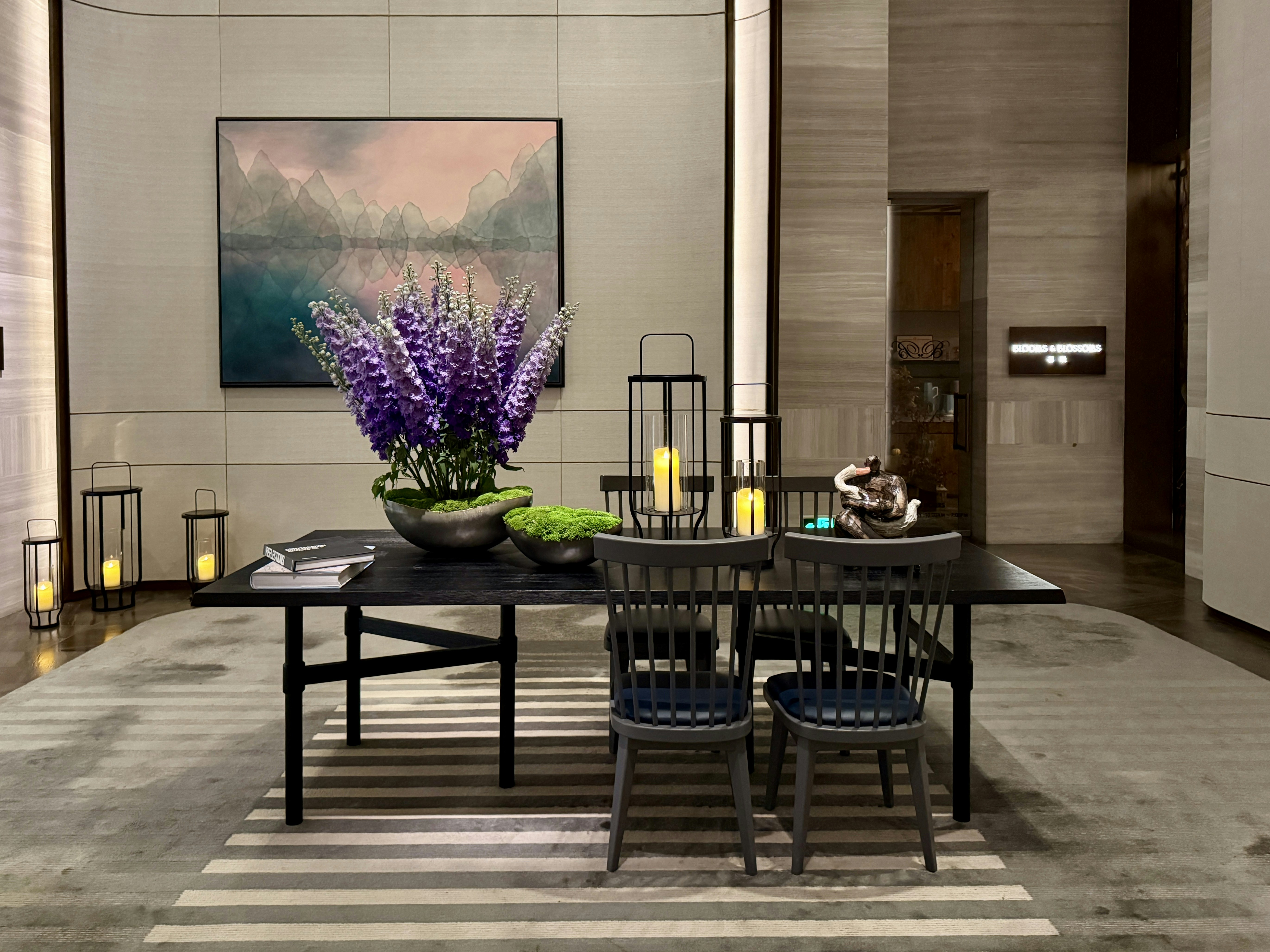A Modern Gallery Dining Table Anchored by Lavender centerpiece