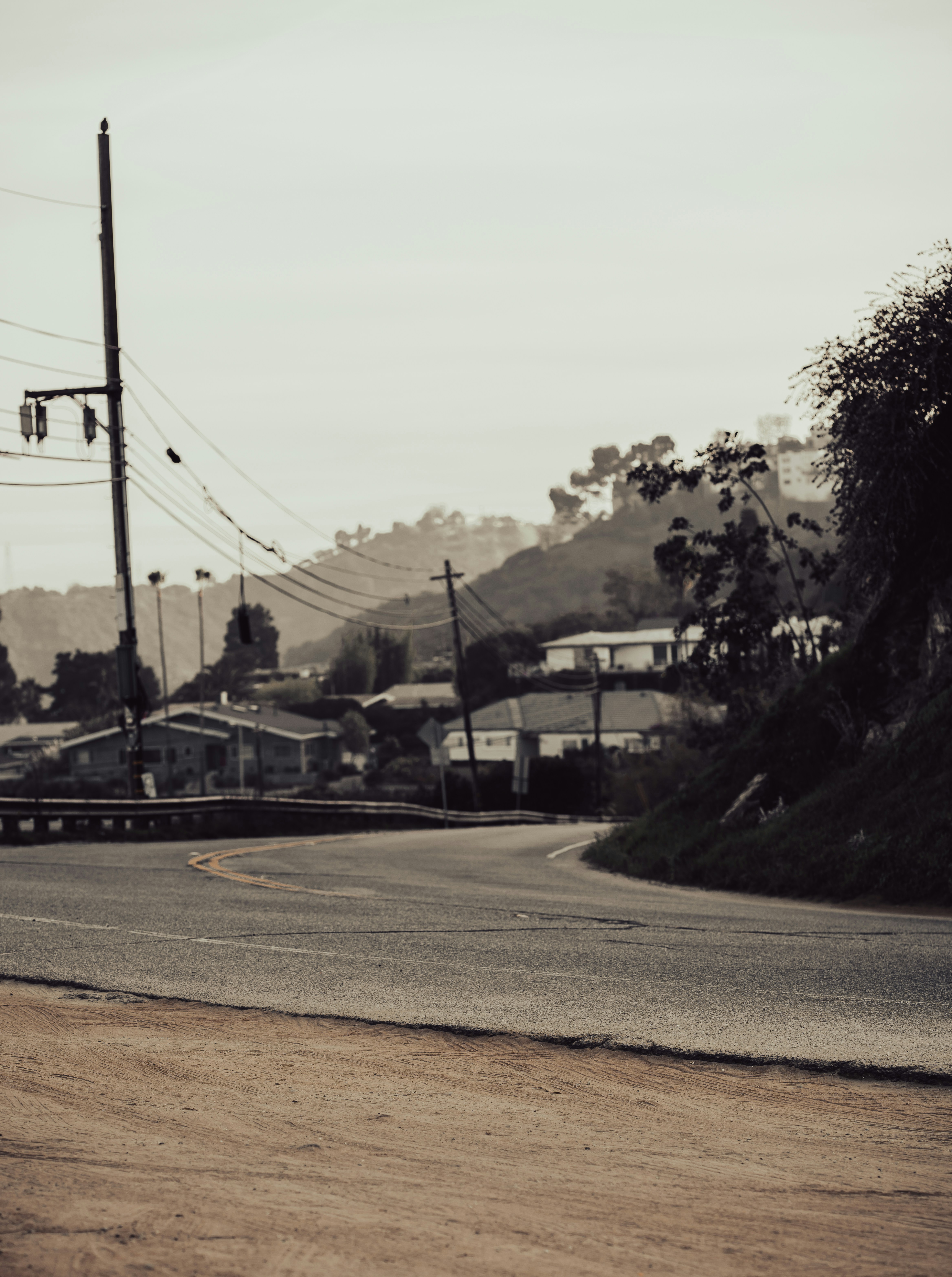 Winding Coastal Road Beneath a Muted Horizon