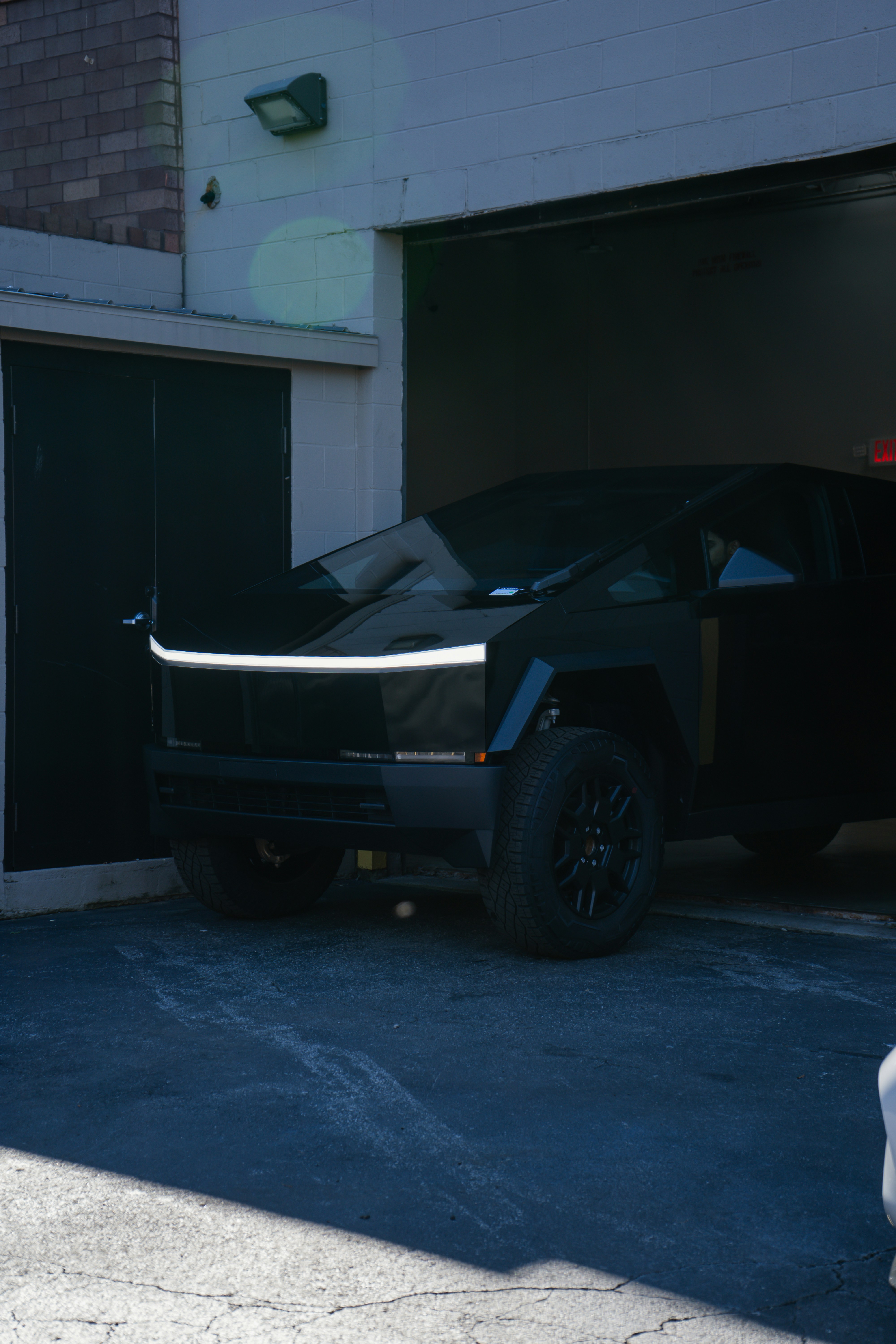 Midnight Bull: A Blocky SUV Emerges from the Garage