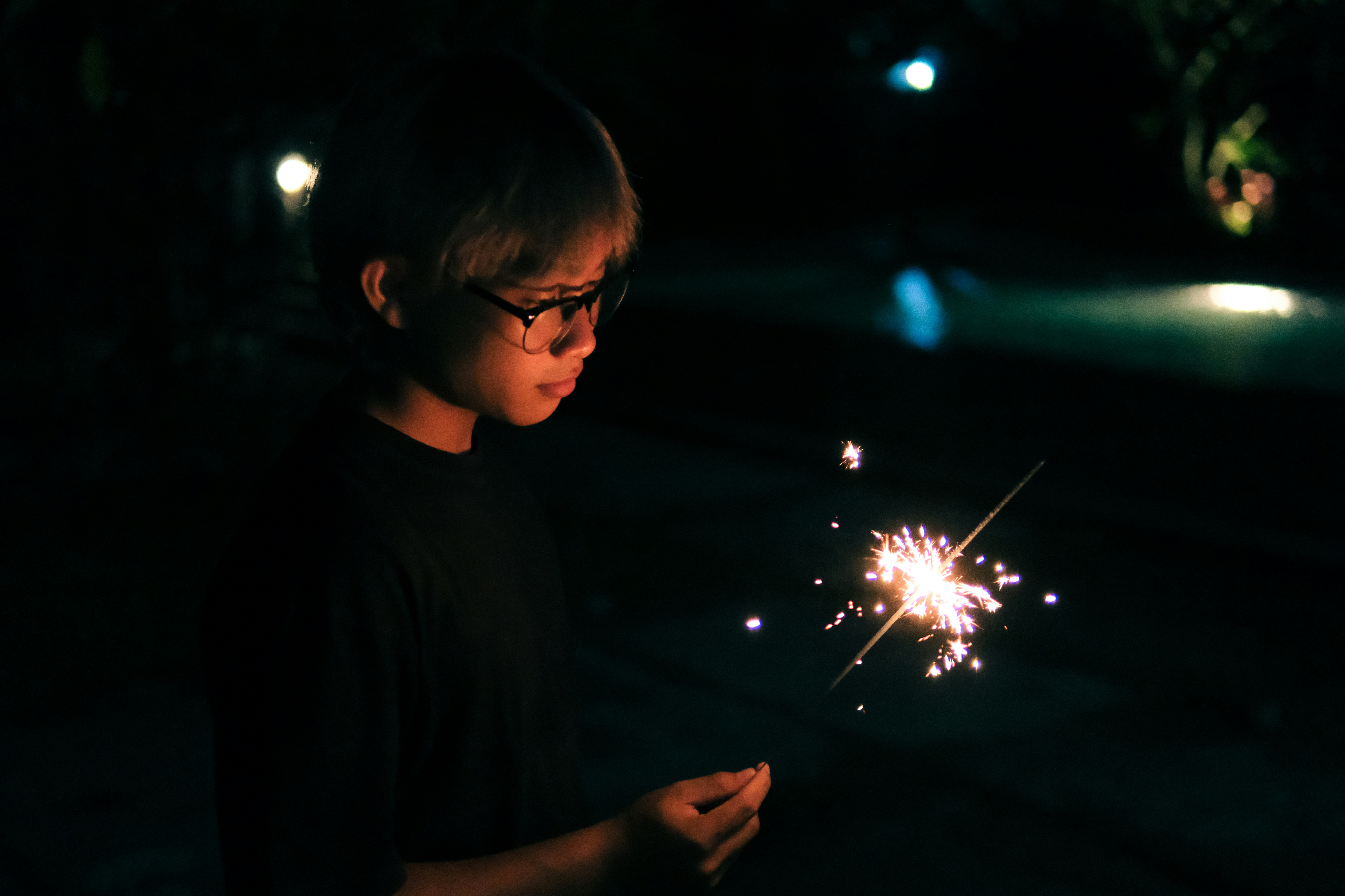 Child with a Spark: Nighttime Sparkler Portrait