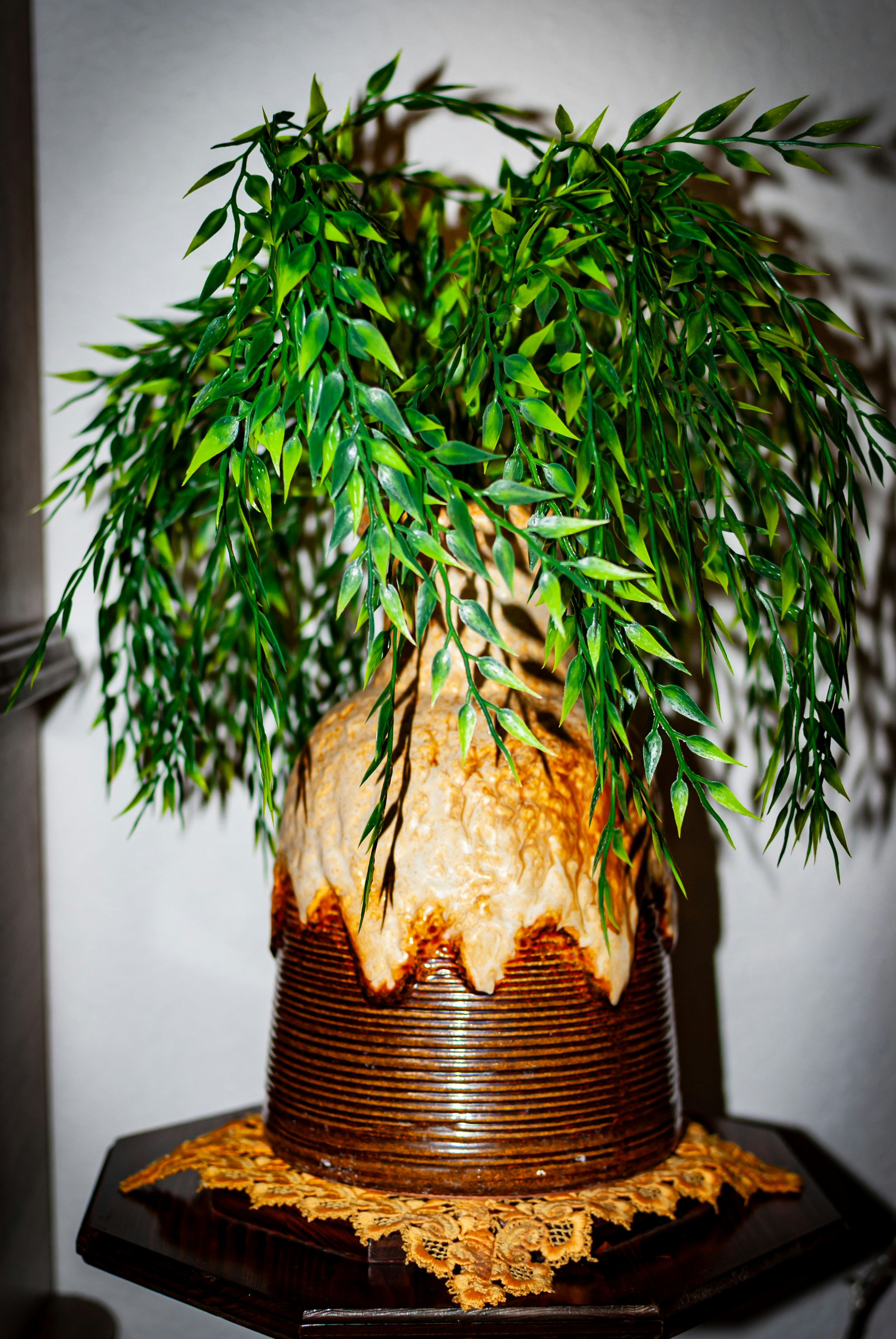 Verdant Crown: A Plant-Topped Cake Surprisingly Surging Above Ceramic Waves