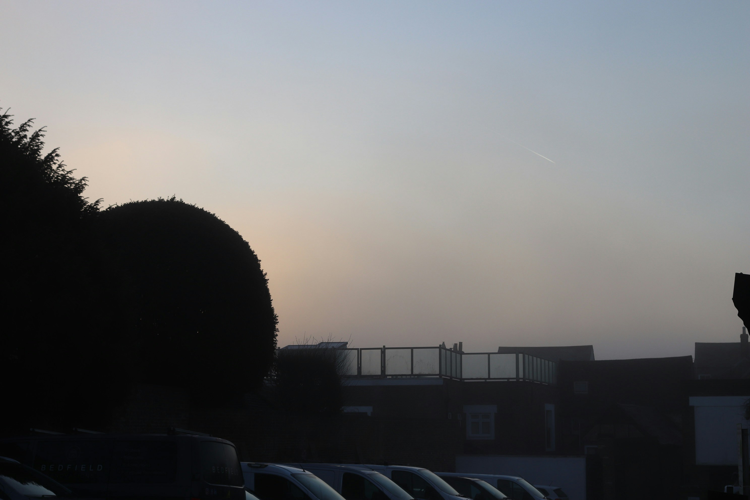 Dawn Over a Quiet Row: Rooftops and Silhouettes at First Light