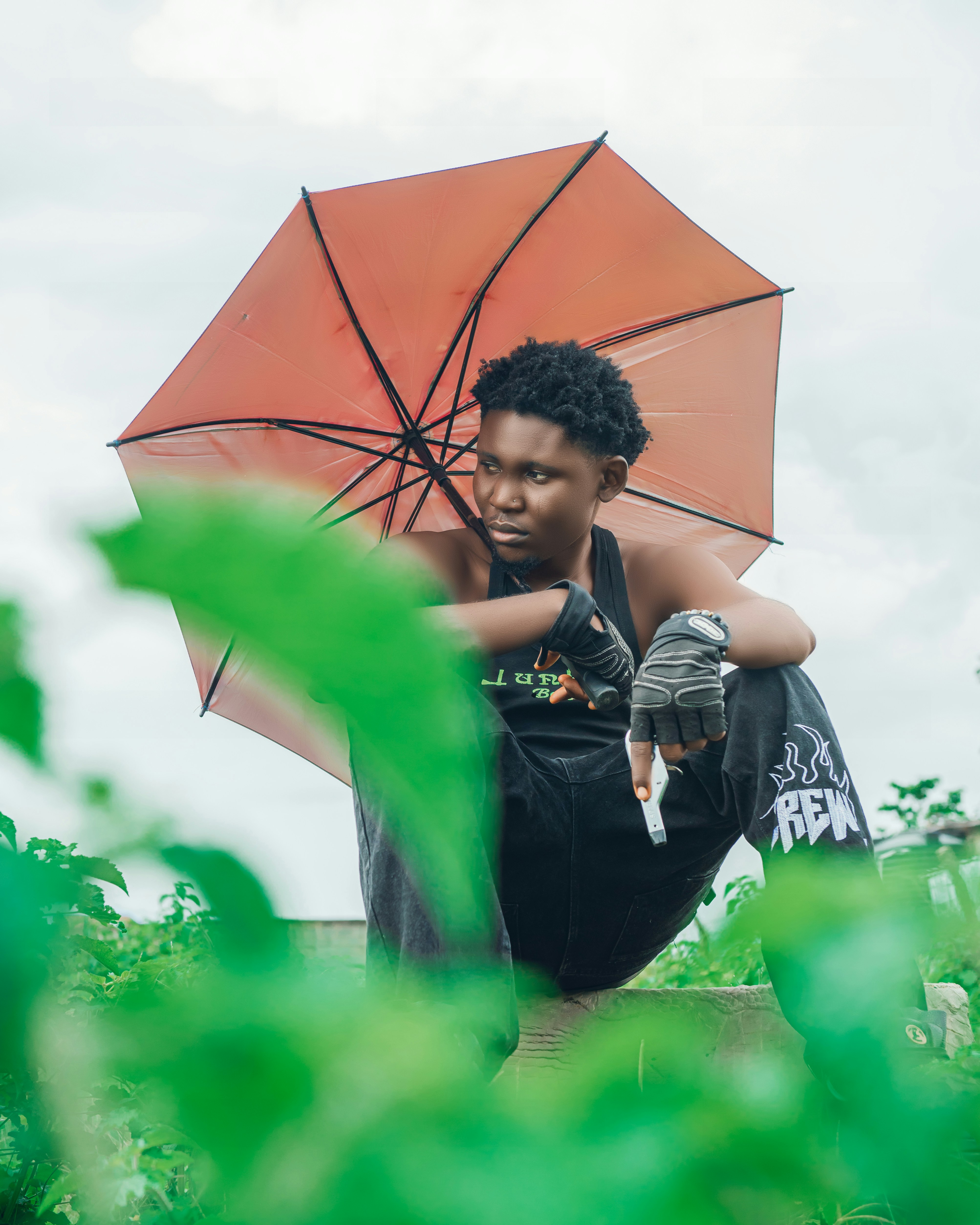 Umbrella Guardian: A Quiet Moment Above the Field
