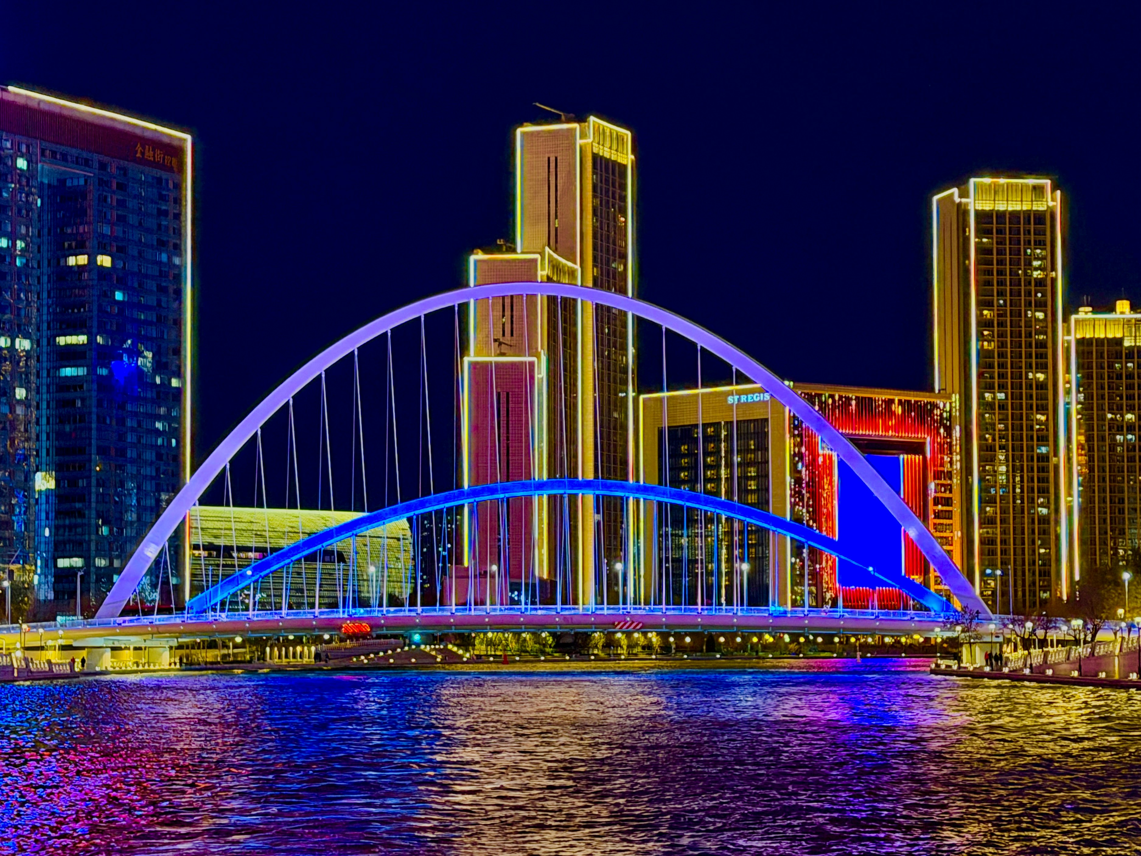 Neon Arc Over the River: Nightscape of a Lit City Bridge
