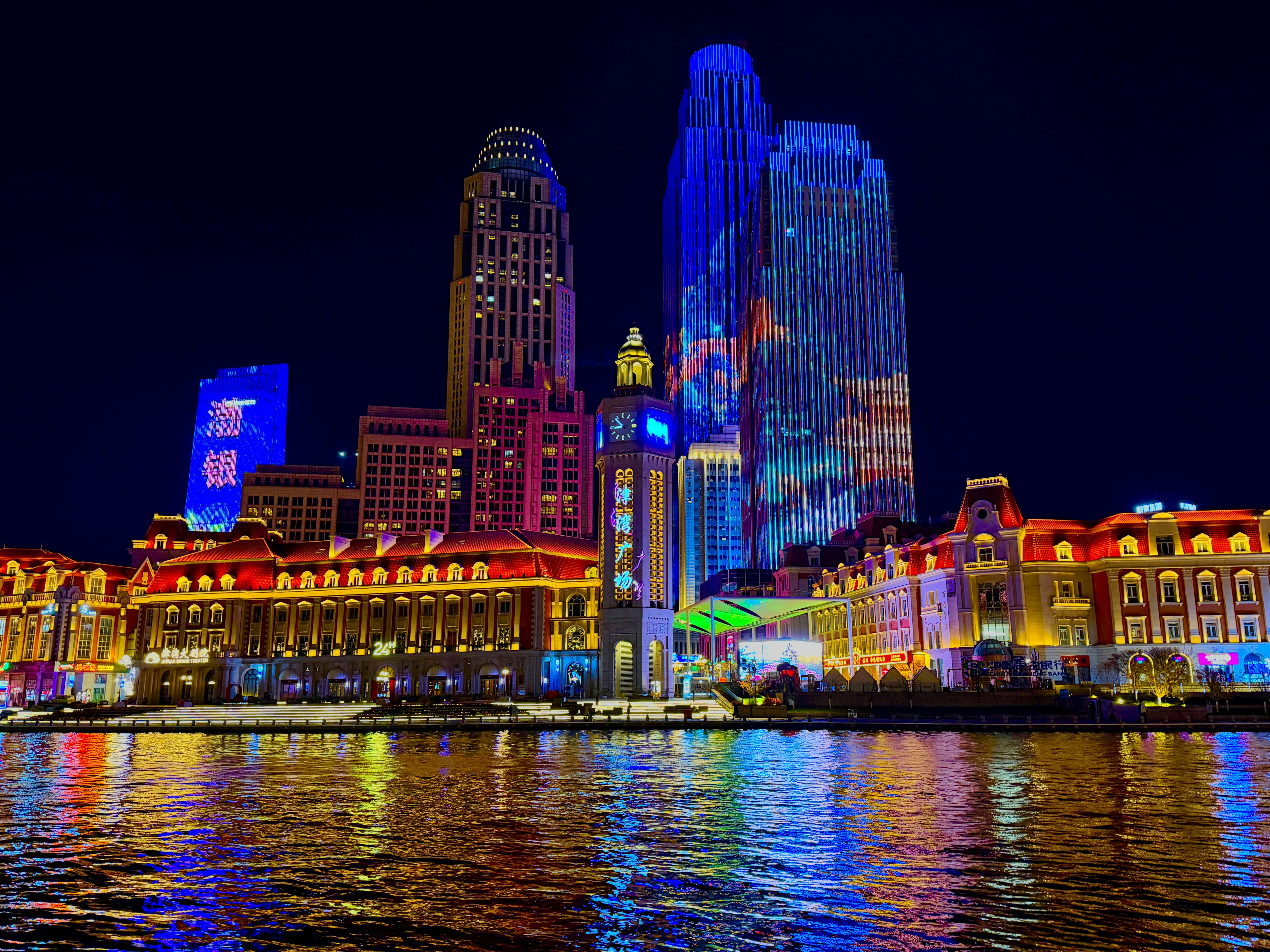 Neon Waterfront: Reflections of a City by Night