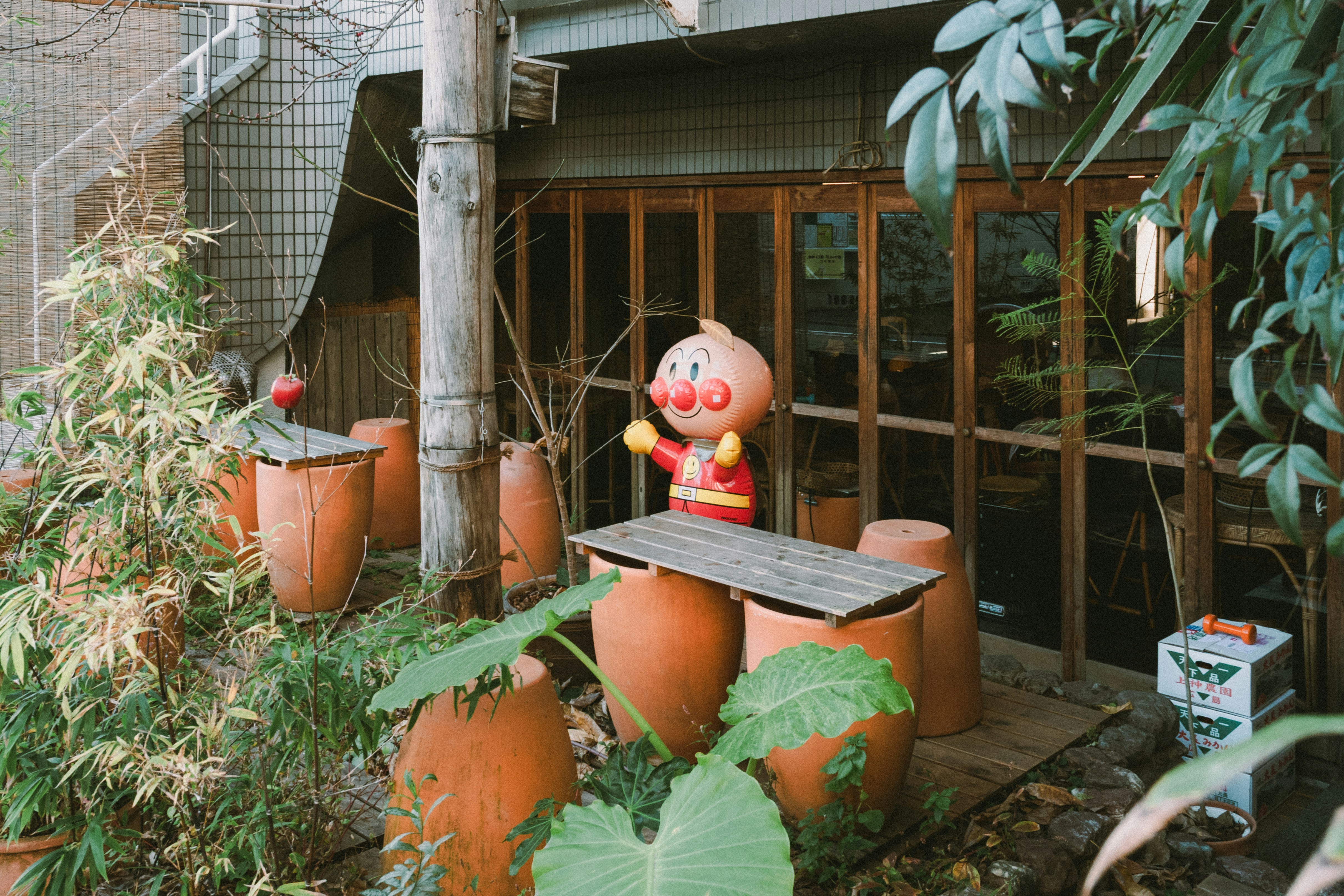Childlike Figure at a Worn Terrace Garden