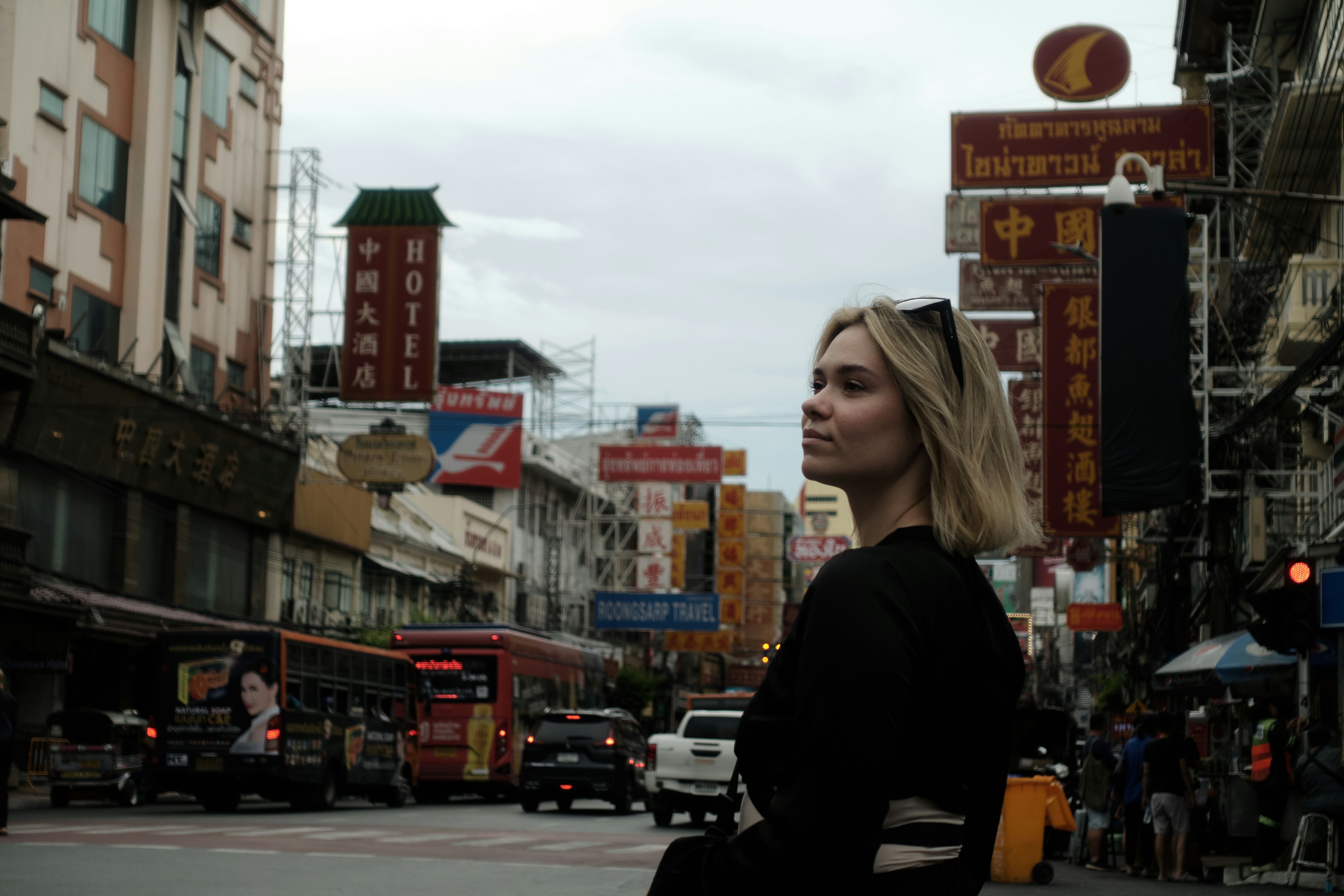 Urban Gaze: The Blonde Foreigner in a Lantern-lit Street