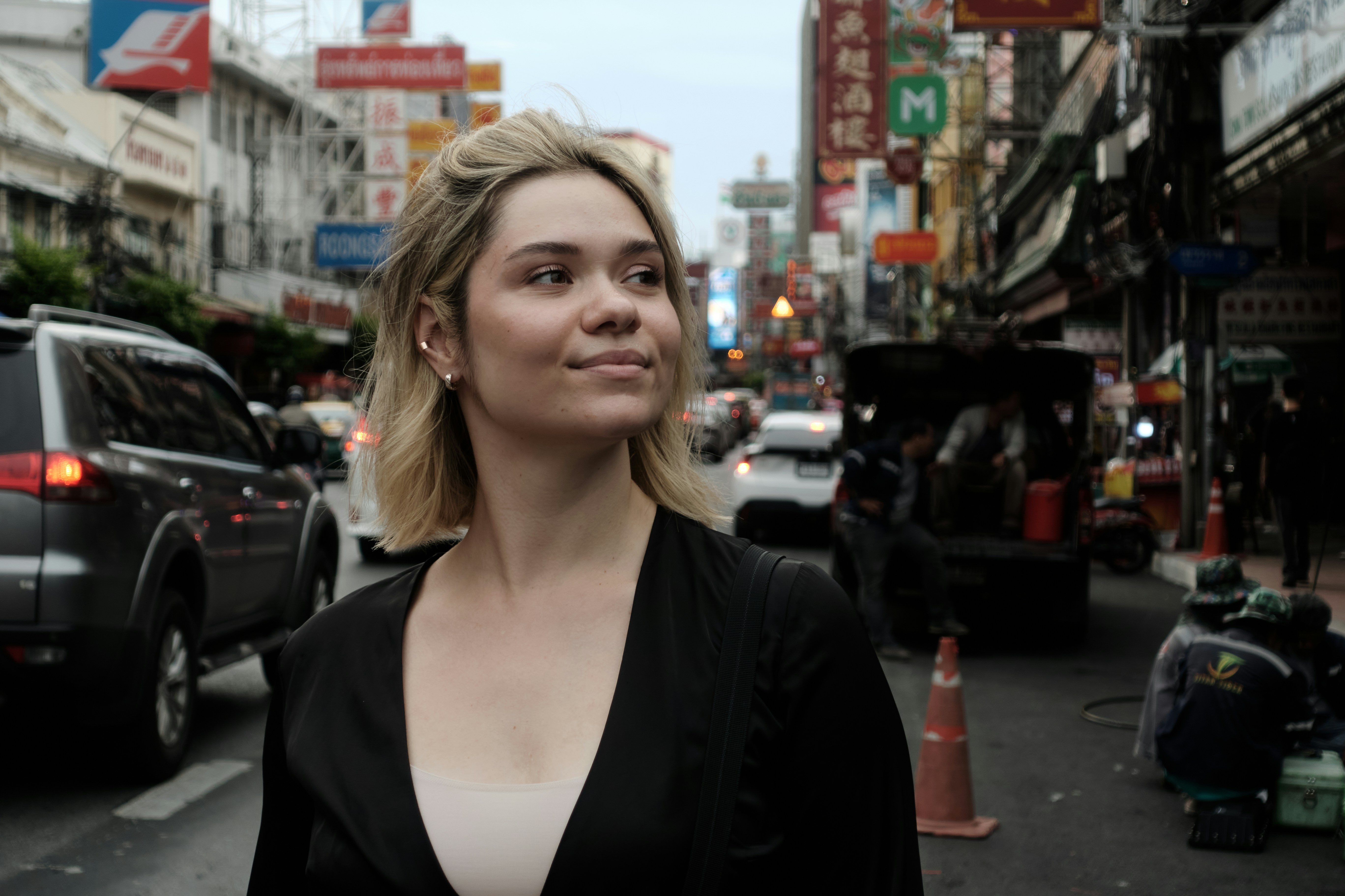 Cityscape Portrait: Quiet Confidence in a Bustling Street