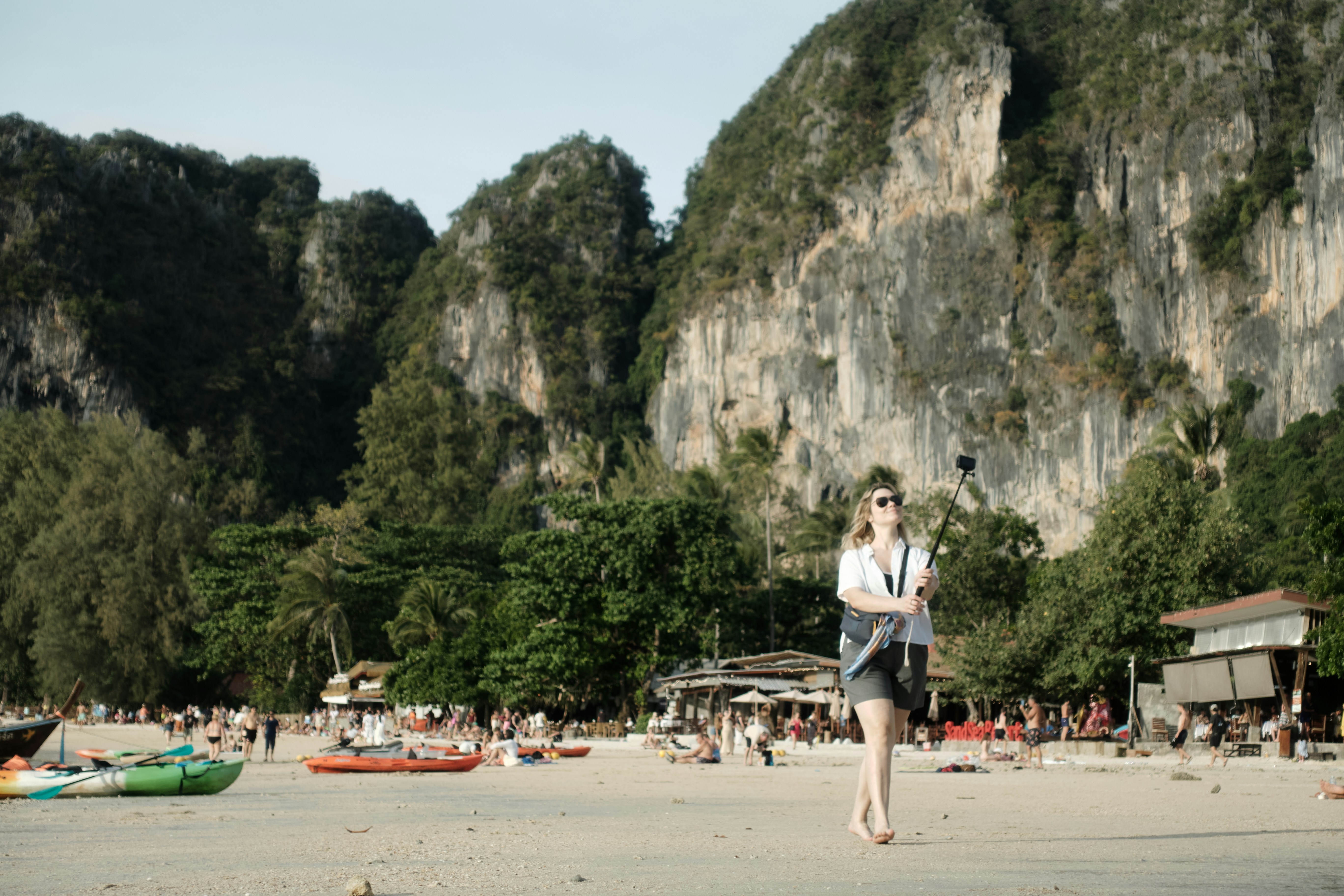 Selfie on the Shore: A Solo Traveler at a Busy Beach