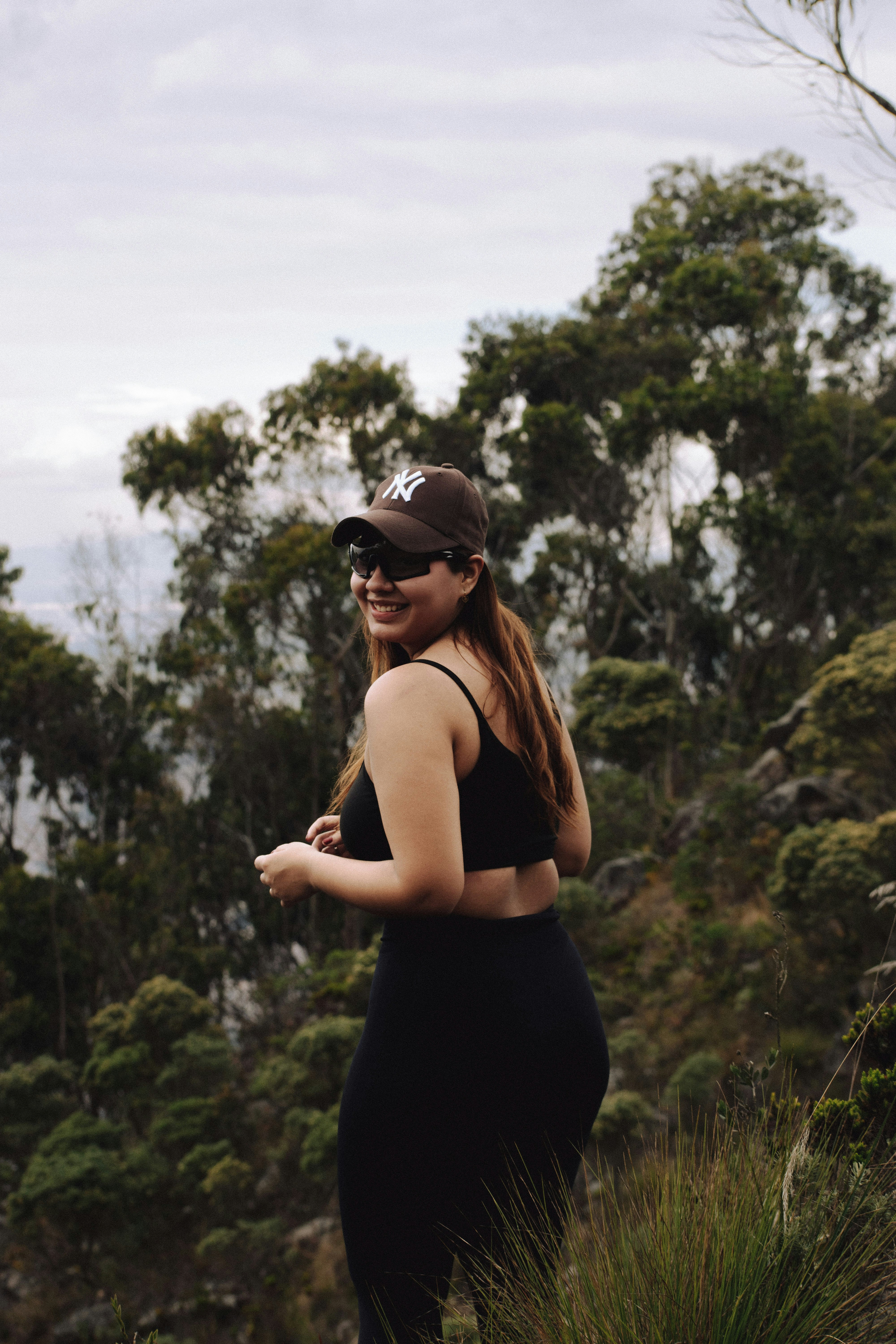 Sunlit silhouette: a confident hillside portrait