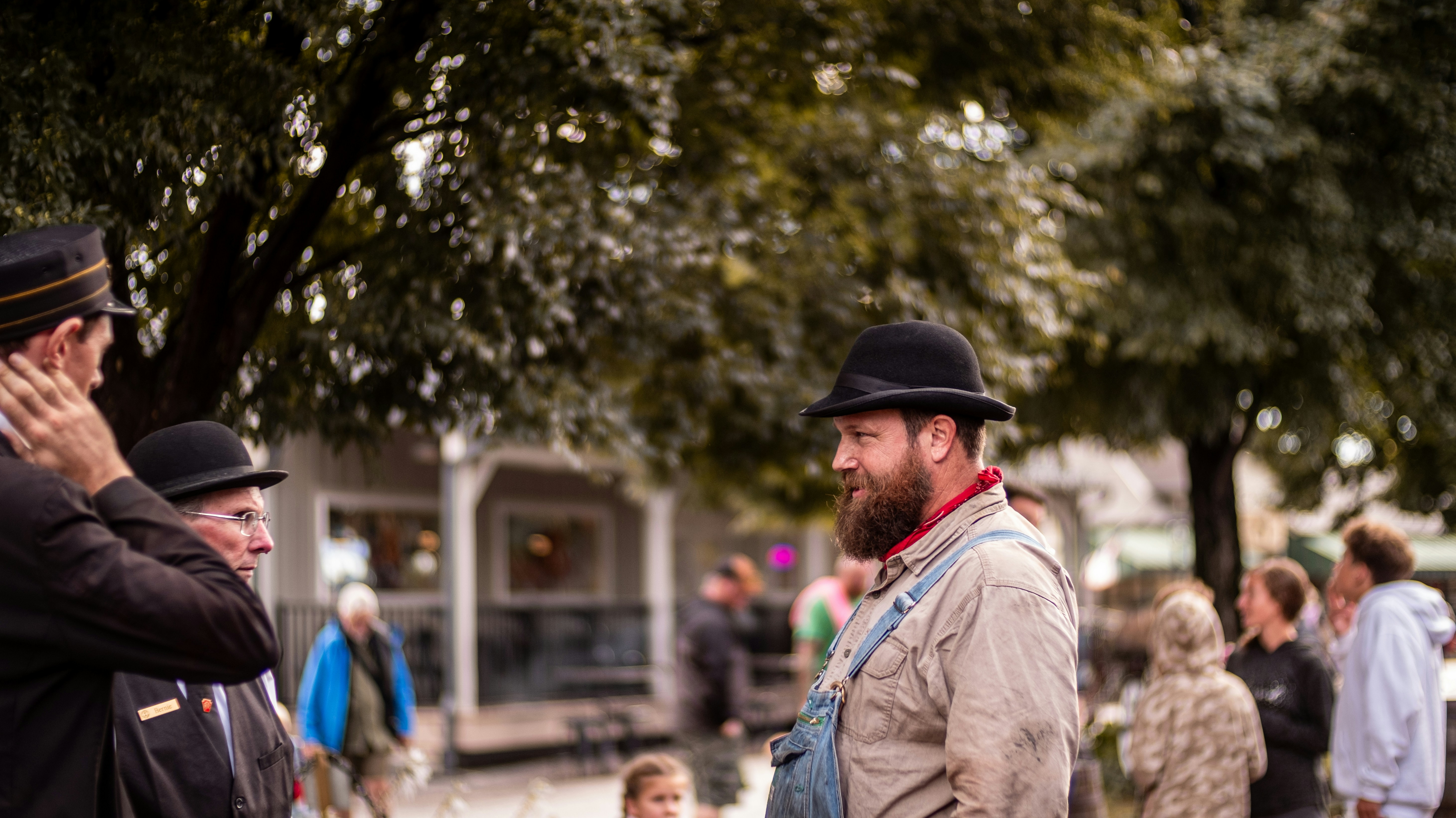 Bearded Man in a Hat Engages a Street Audience