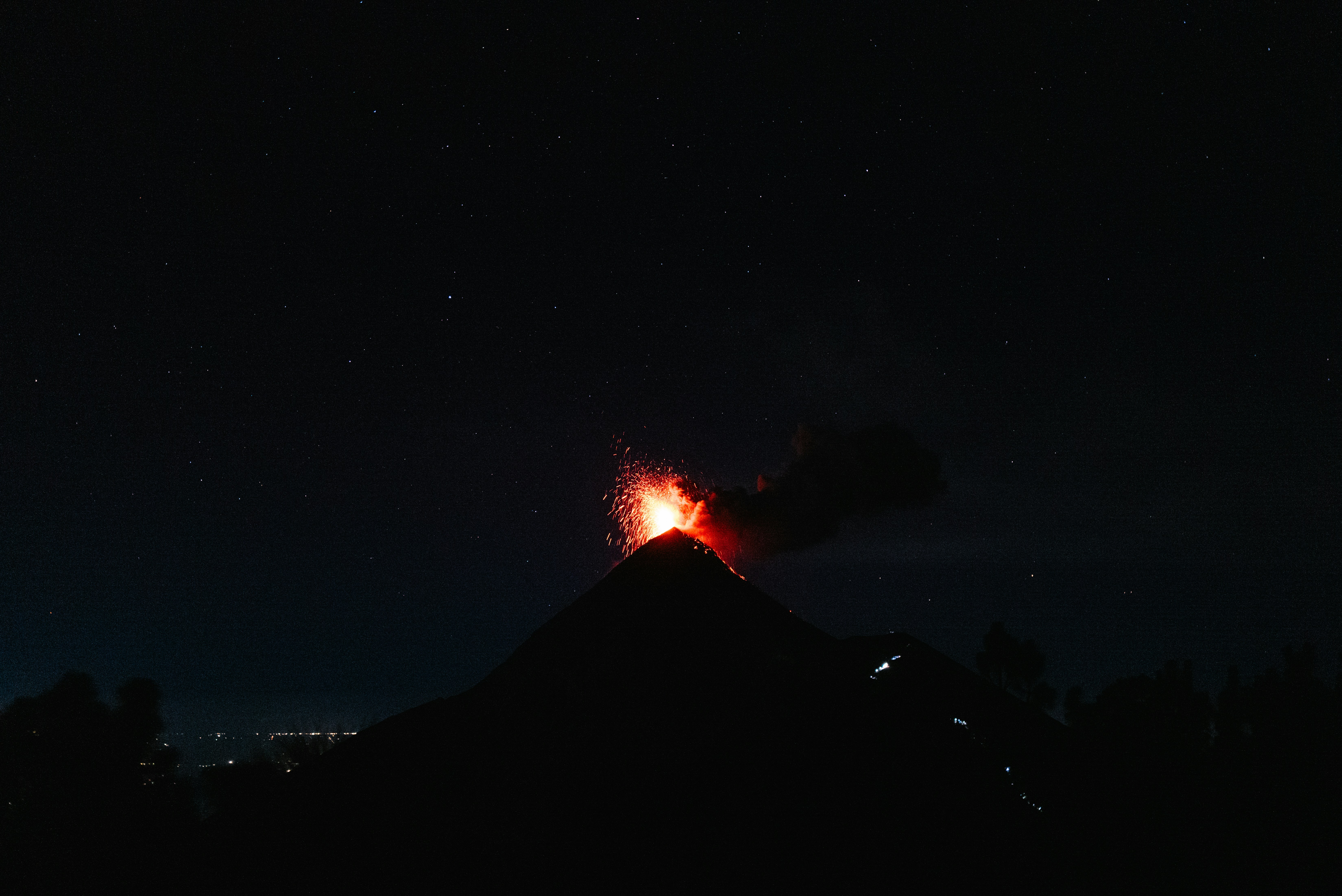 Luminous Crest: Night Volcano Eruption