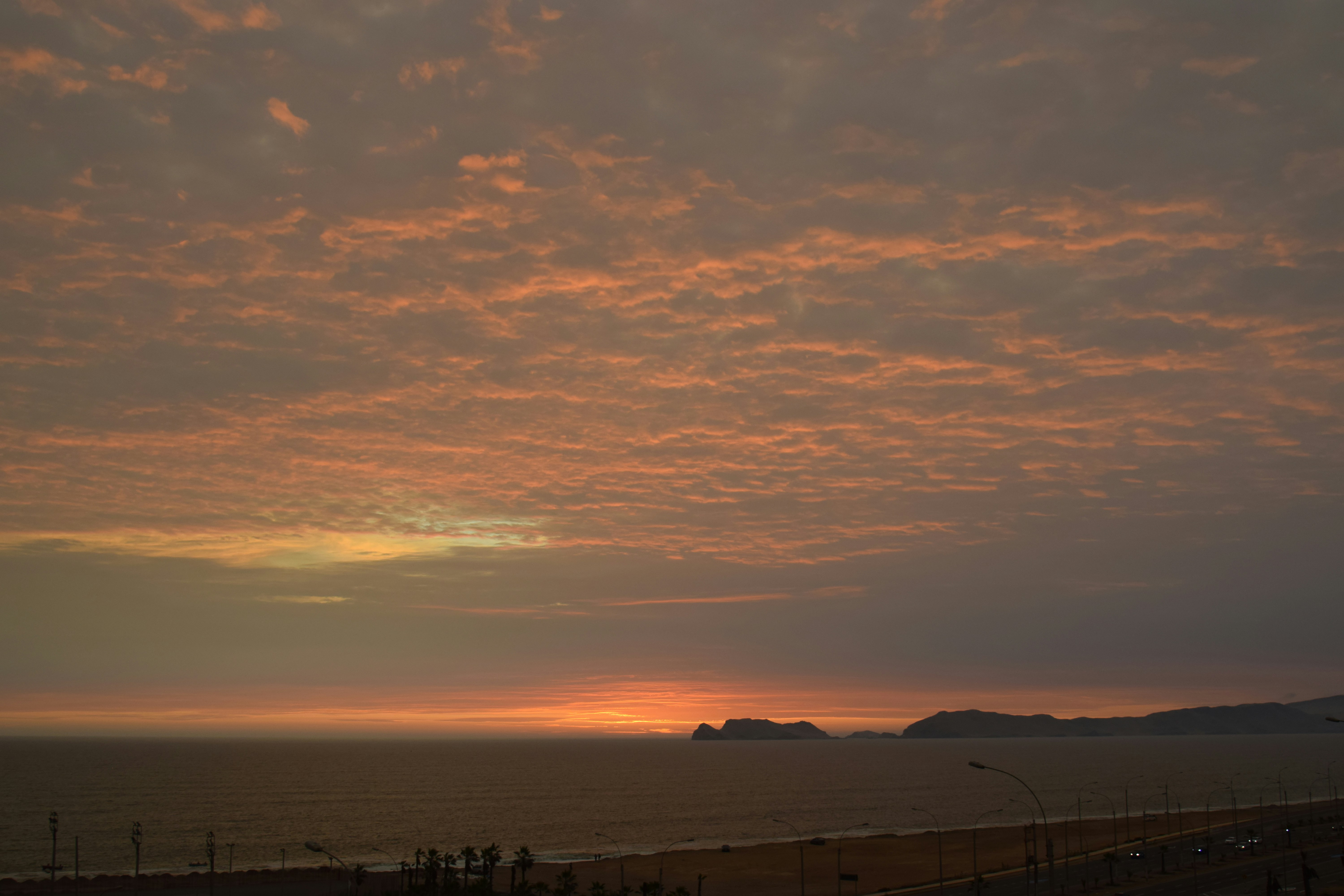 Golden Horizon: Sunset Over a Quiet Seaboard