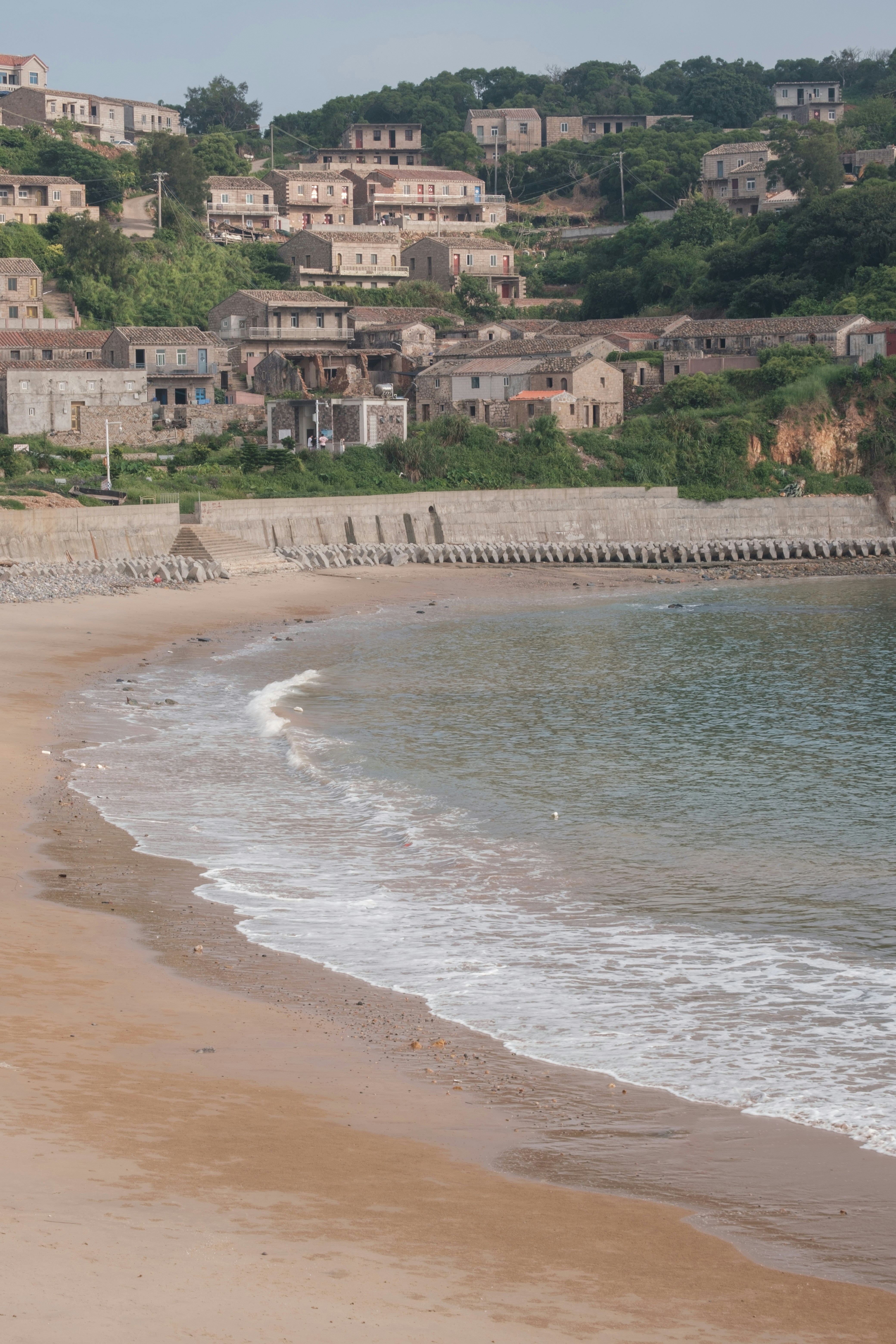 Harbored Village Rising Behind a Quiet Shore
